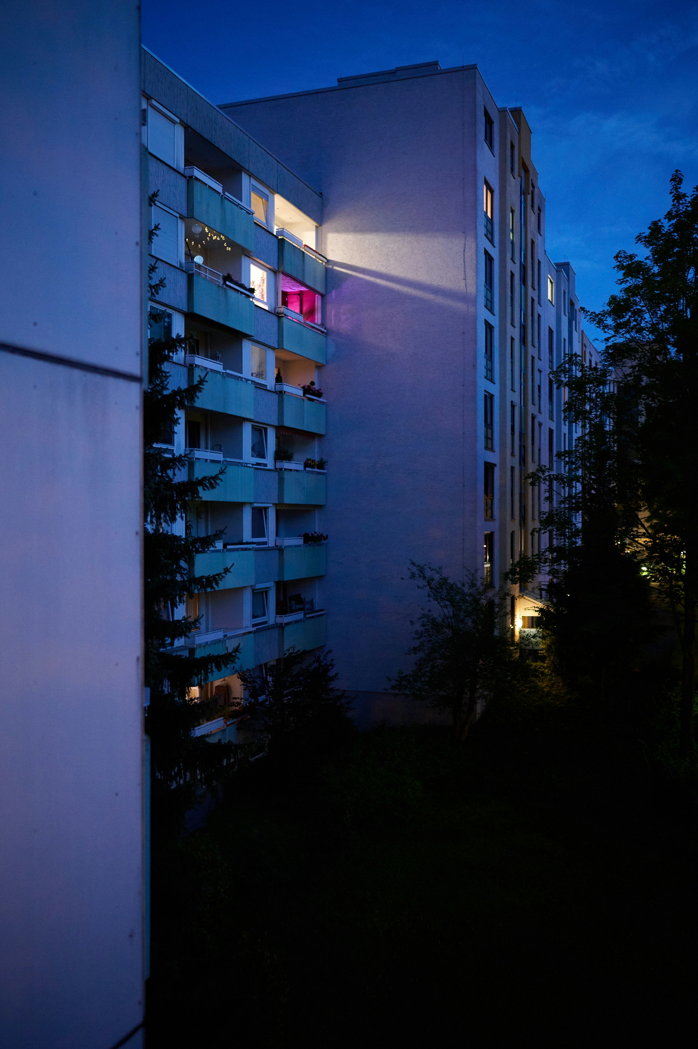Blue Hour Windows: Neon Hues Between Concrete Towers