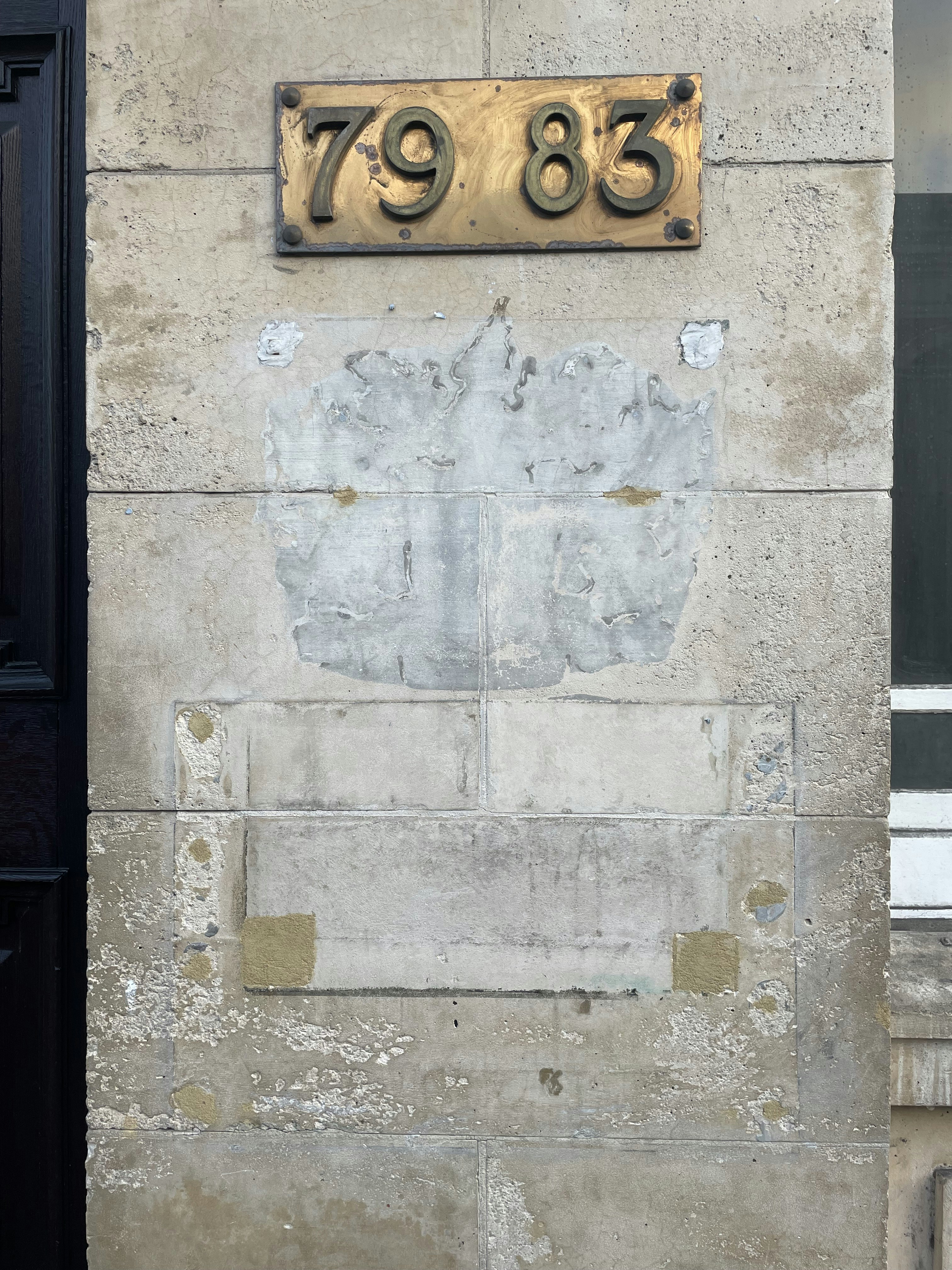 A sign on the side of a building that reads 783 photo – Free Wall Image ...