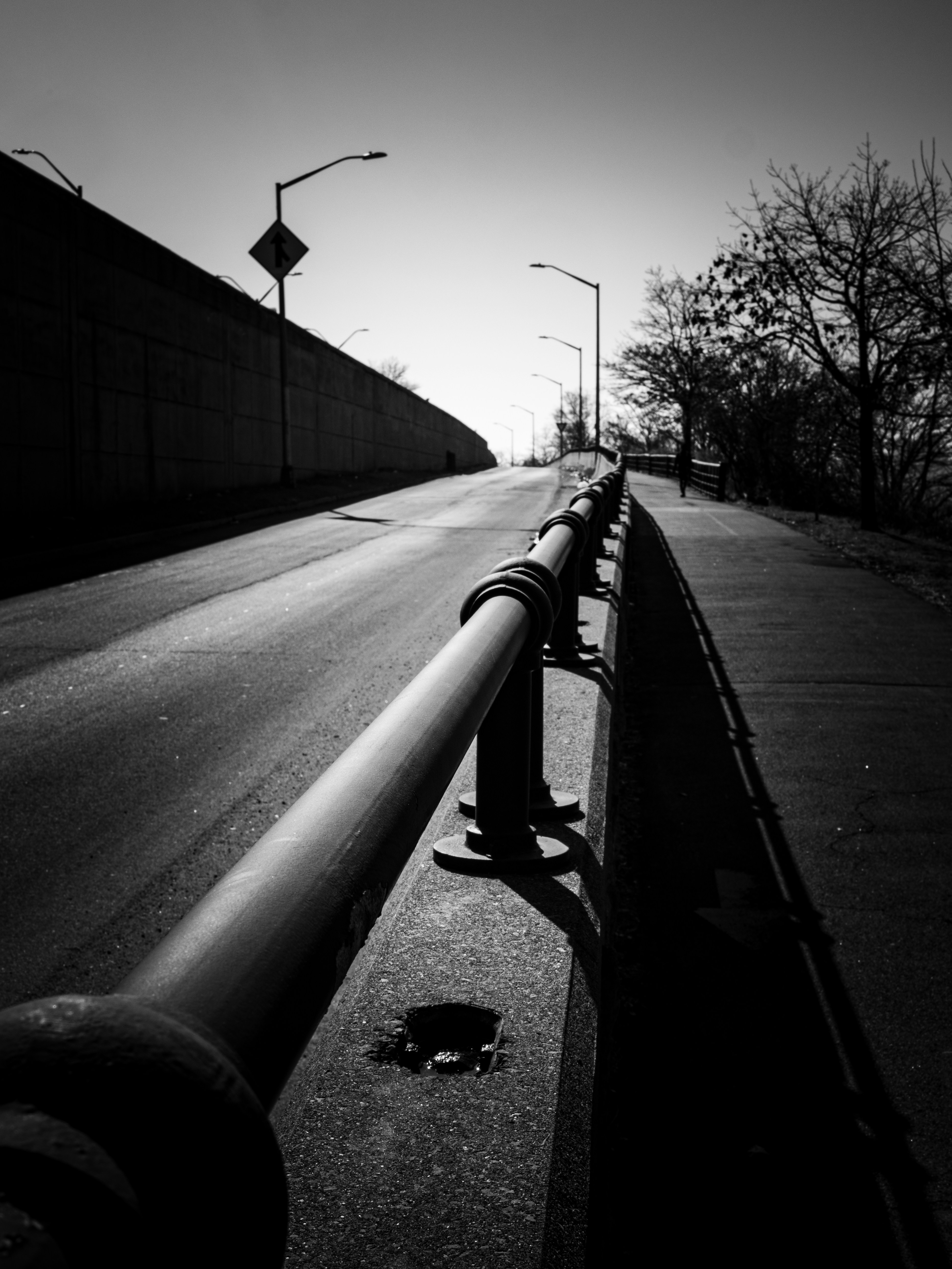 a black and white photo of a street