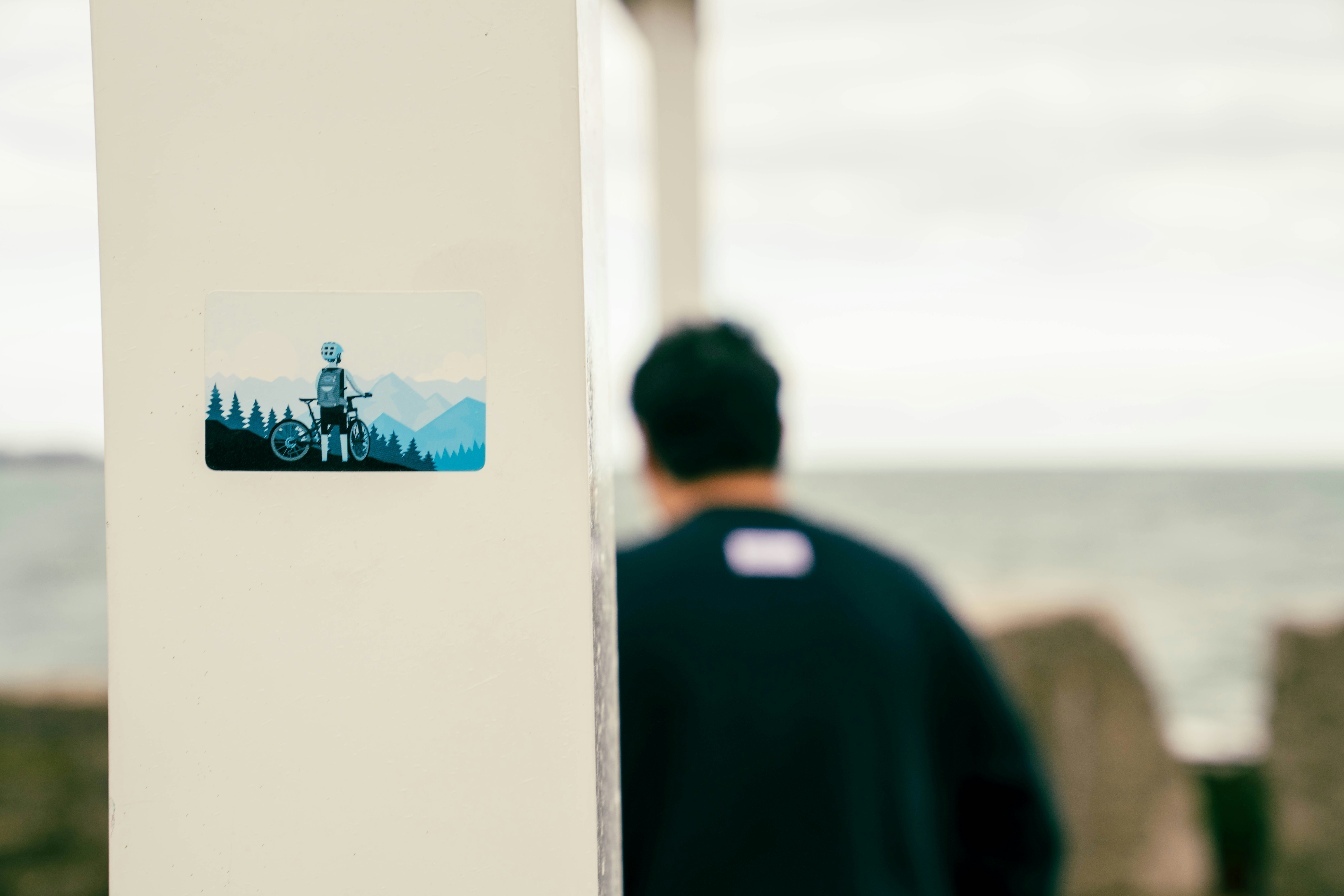 Partial Portrait: A solitary figure by the sea