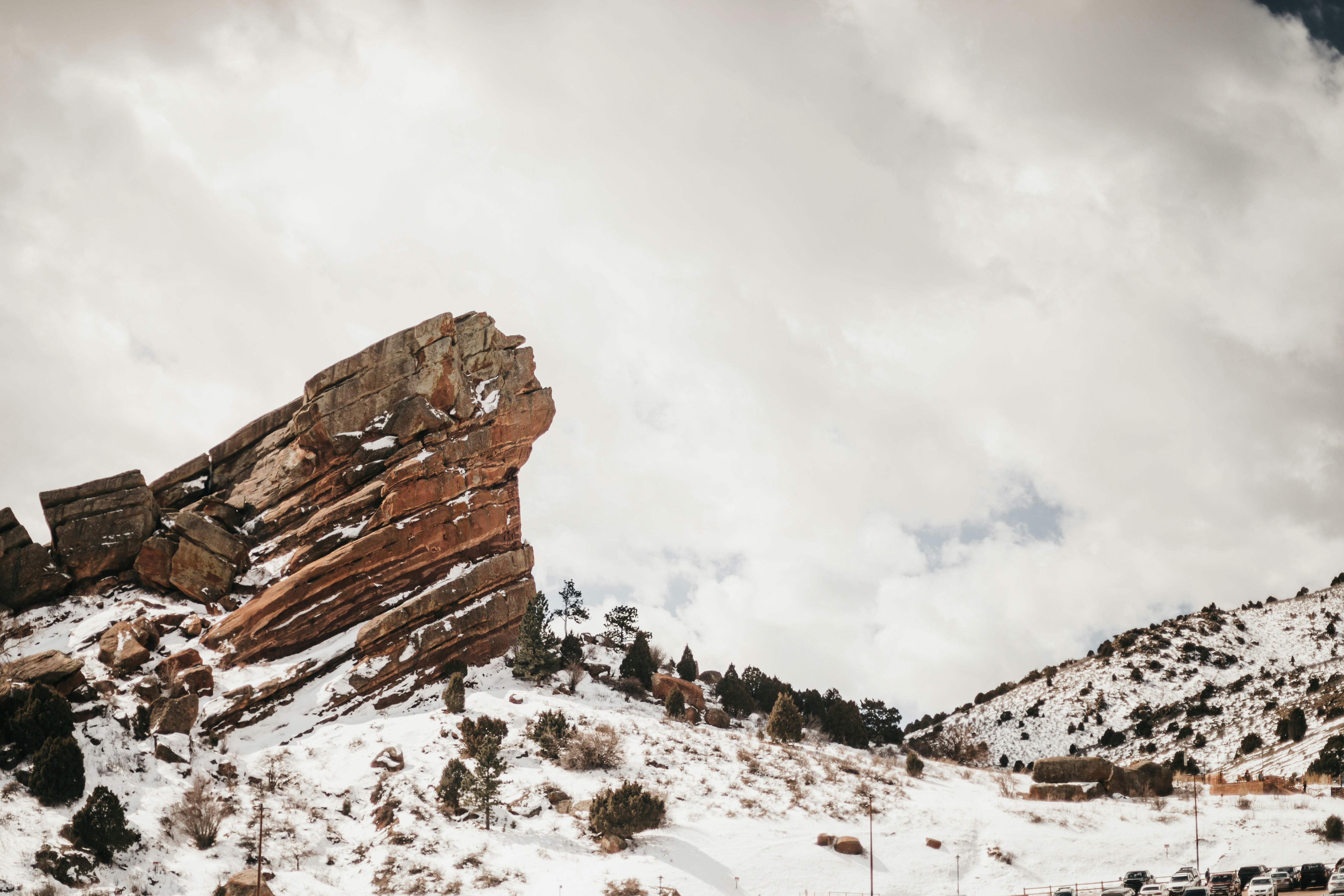 A large rock formation in the middle of a snowy landscape photo – Free ...