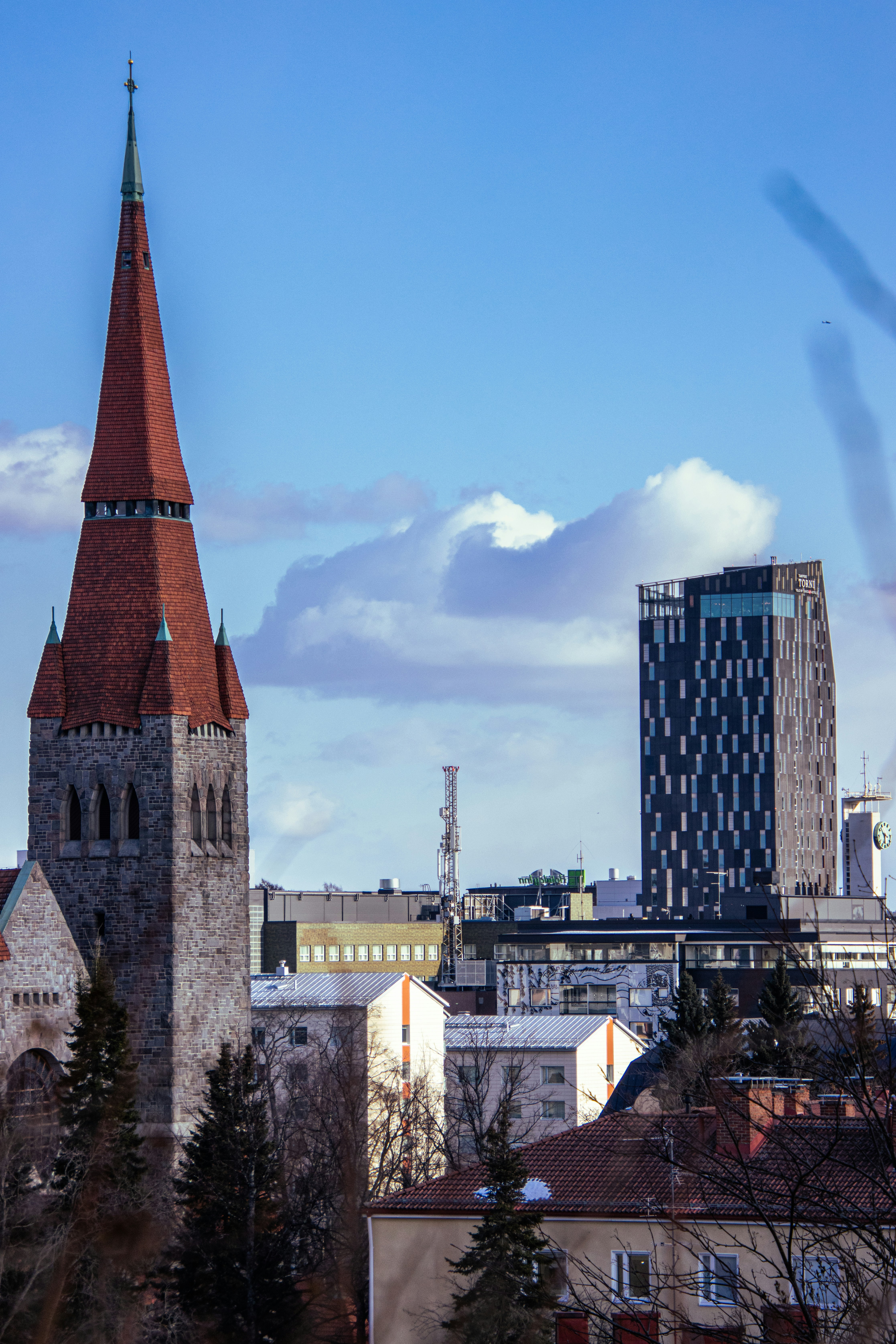 Gothic Spire Meets Modern Glass: A Quiet City Contrast Under Cerulean Skies