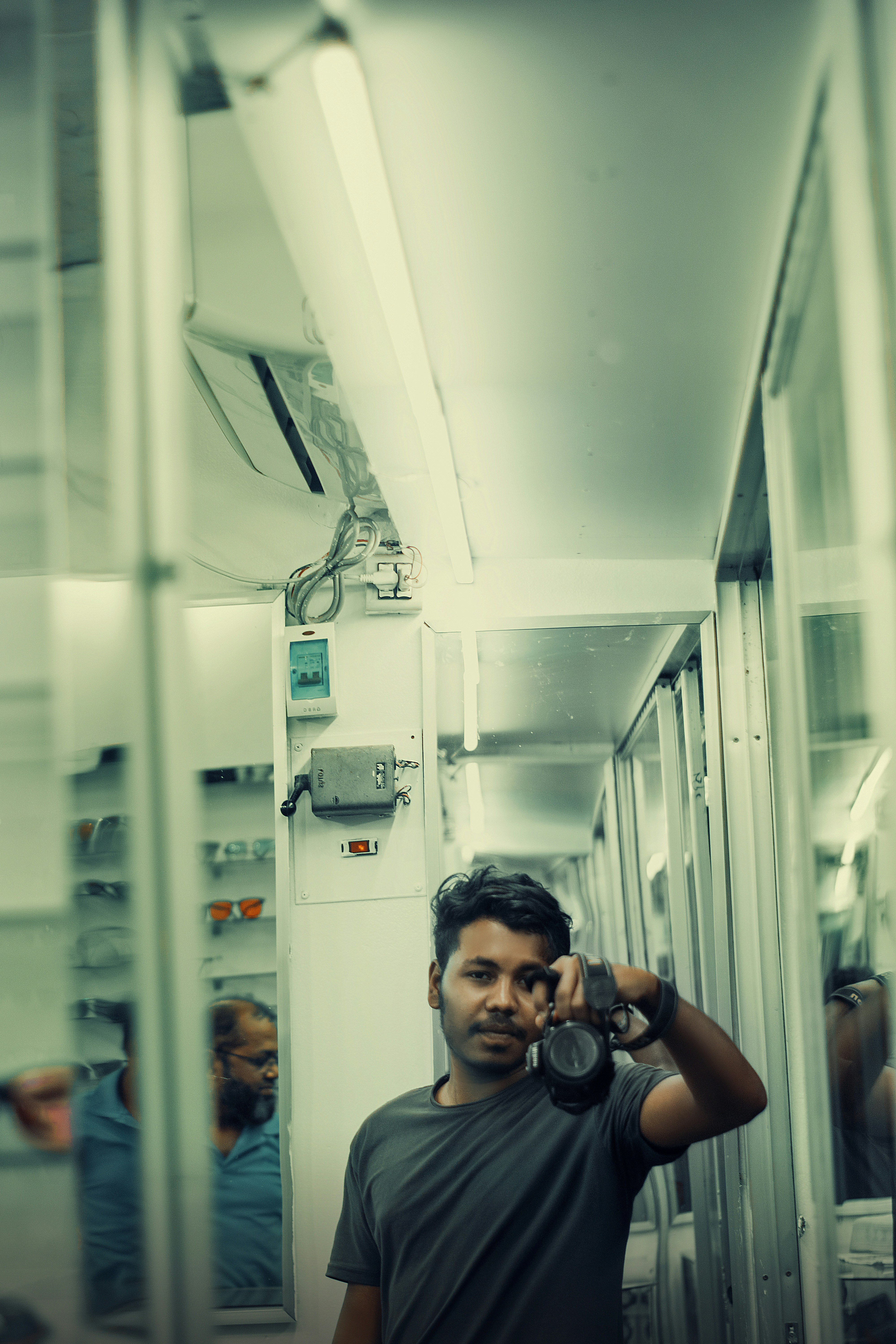 Mirror-Tunnel Self-Portrait in a Neon-Illuminated Subway Car