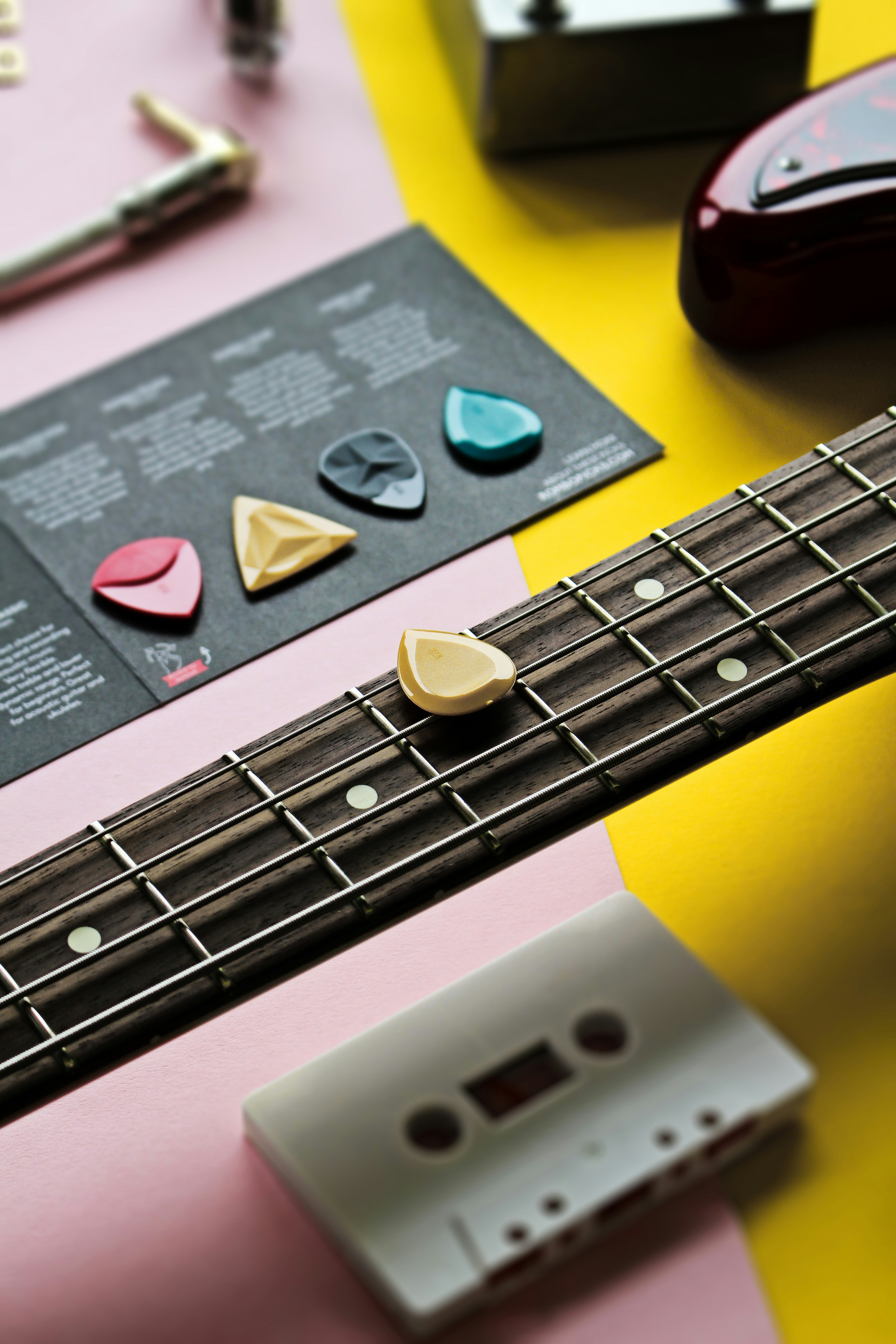 A guitar neck with a guitar picker attached to it photo – Free Bass ...