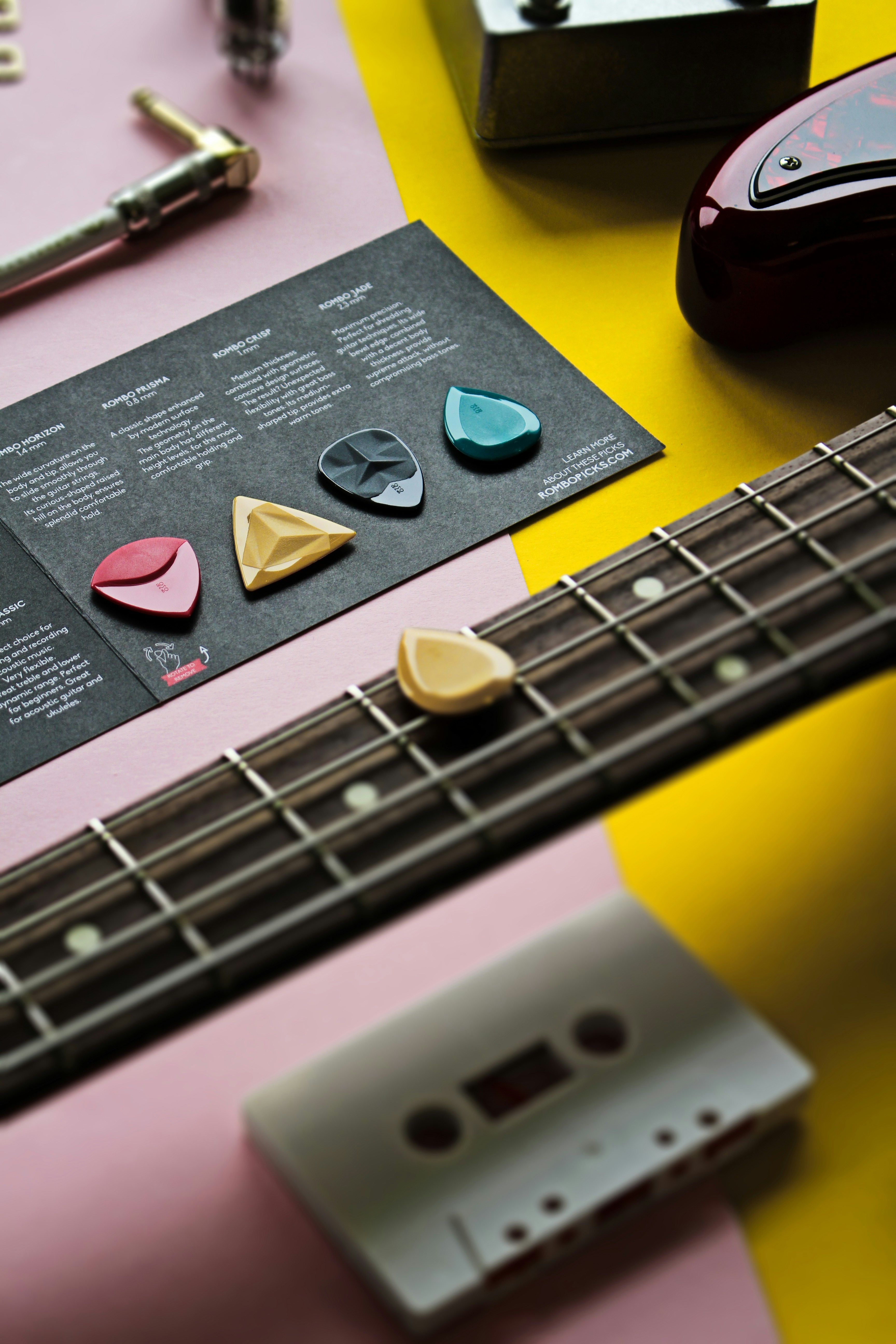 A close up of a guitar with a guitar picker photo – Free Plectrum Image ...