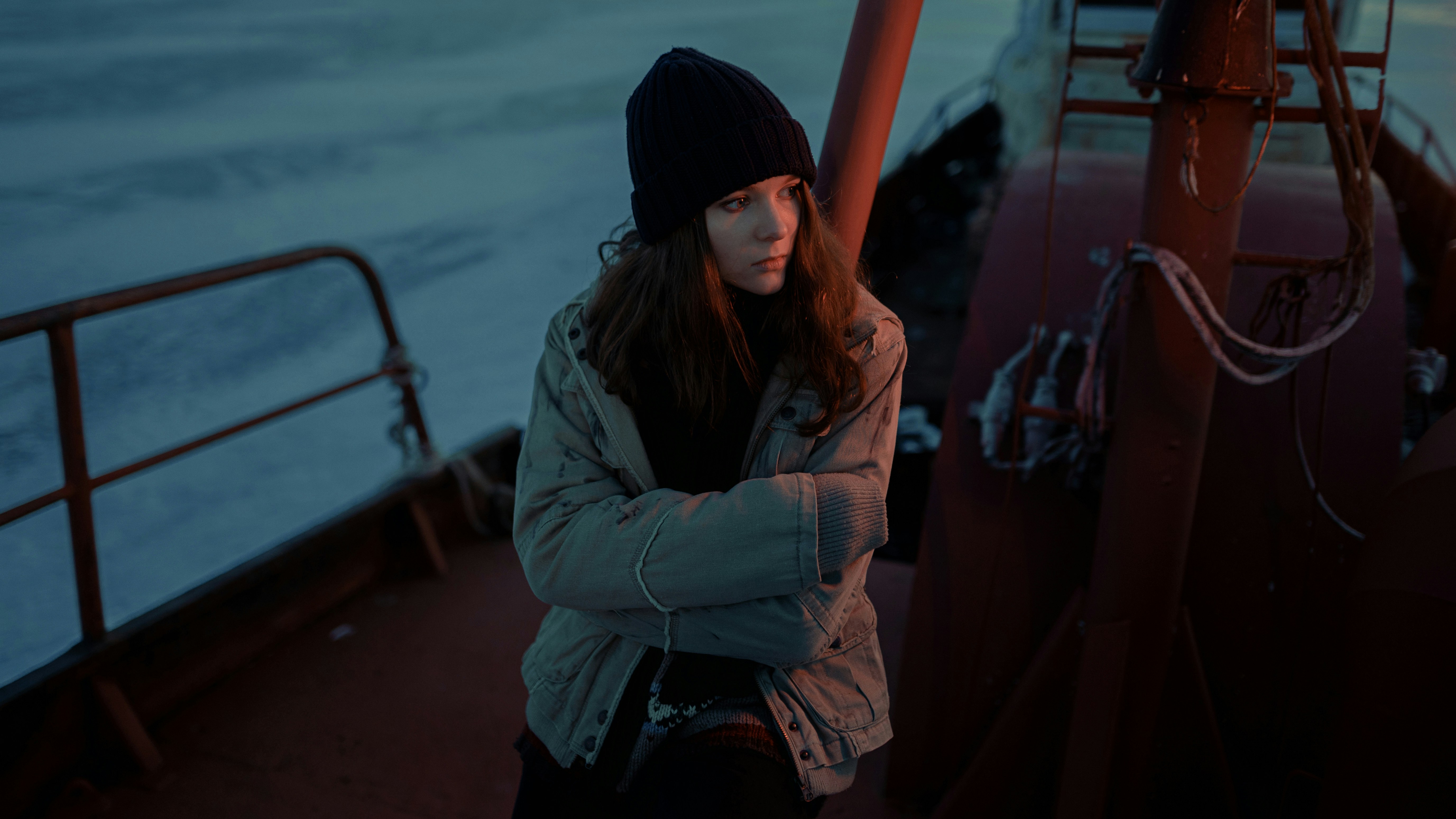 Blue Hour Portrait Aboard a Cold Vessel: A Quiet Moment on the Bow