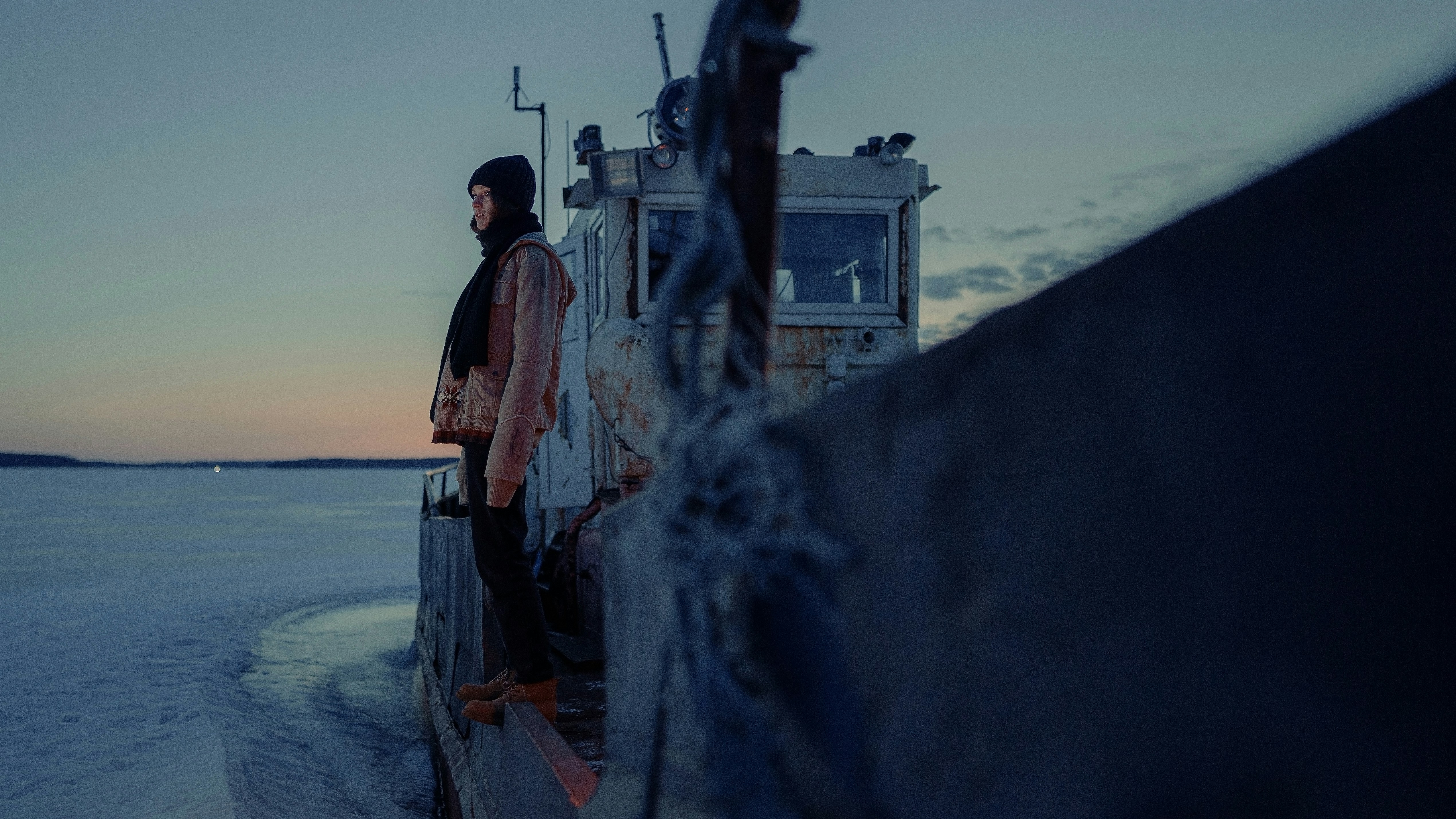 Dusk Aboard the Frost-Washed Deck: A Lone Figure at the Horizon
