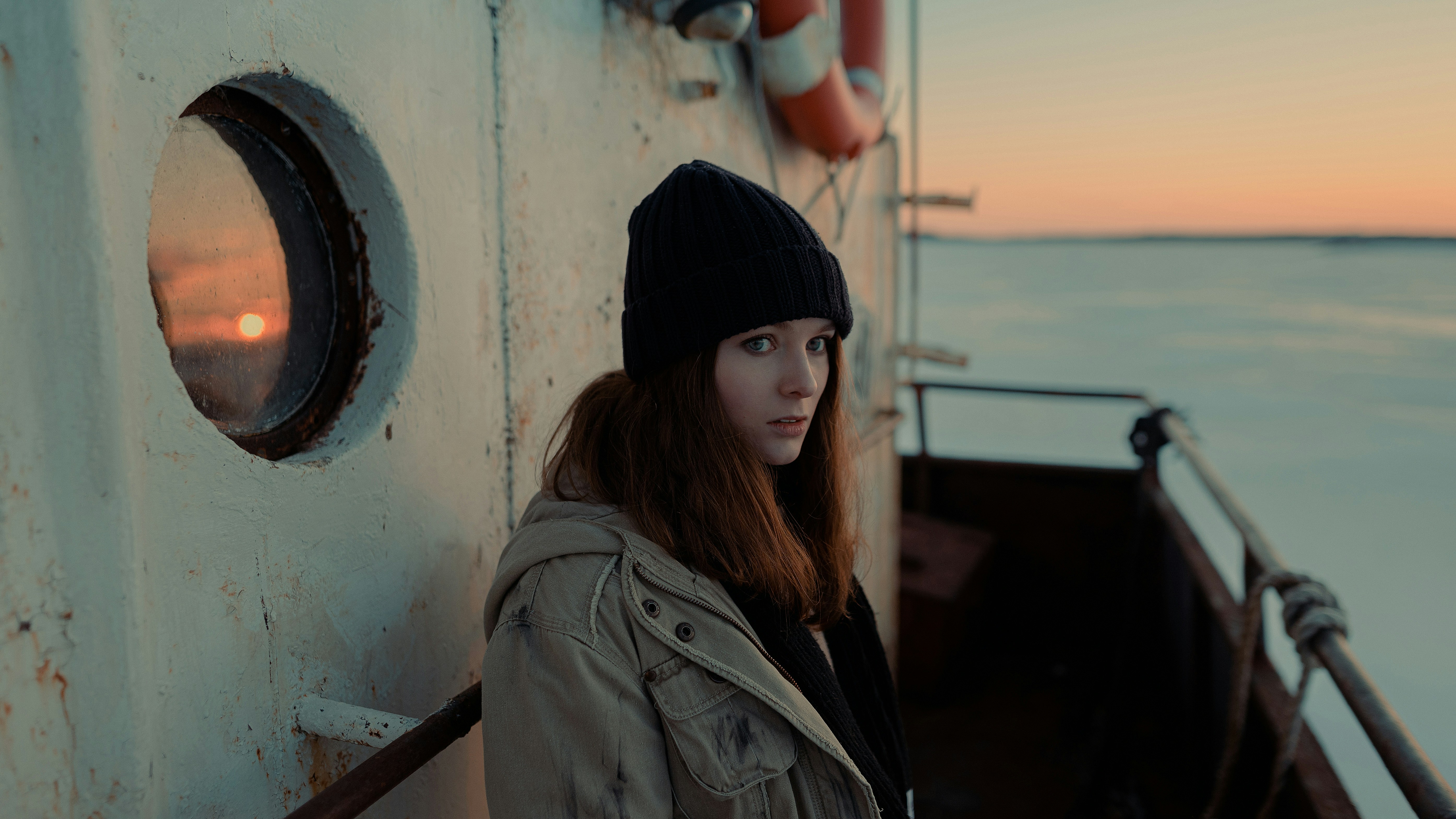 Glimmer at the Bow: A Quiet Portrait Aboard at Sunset
