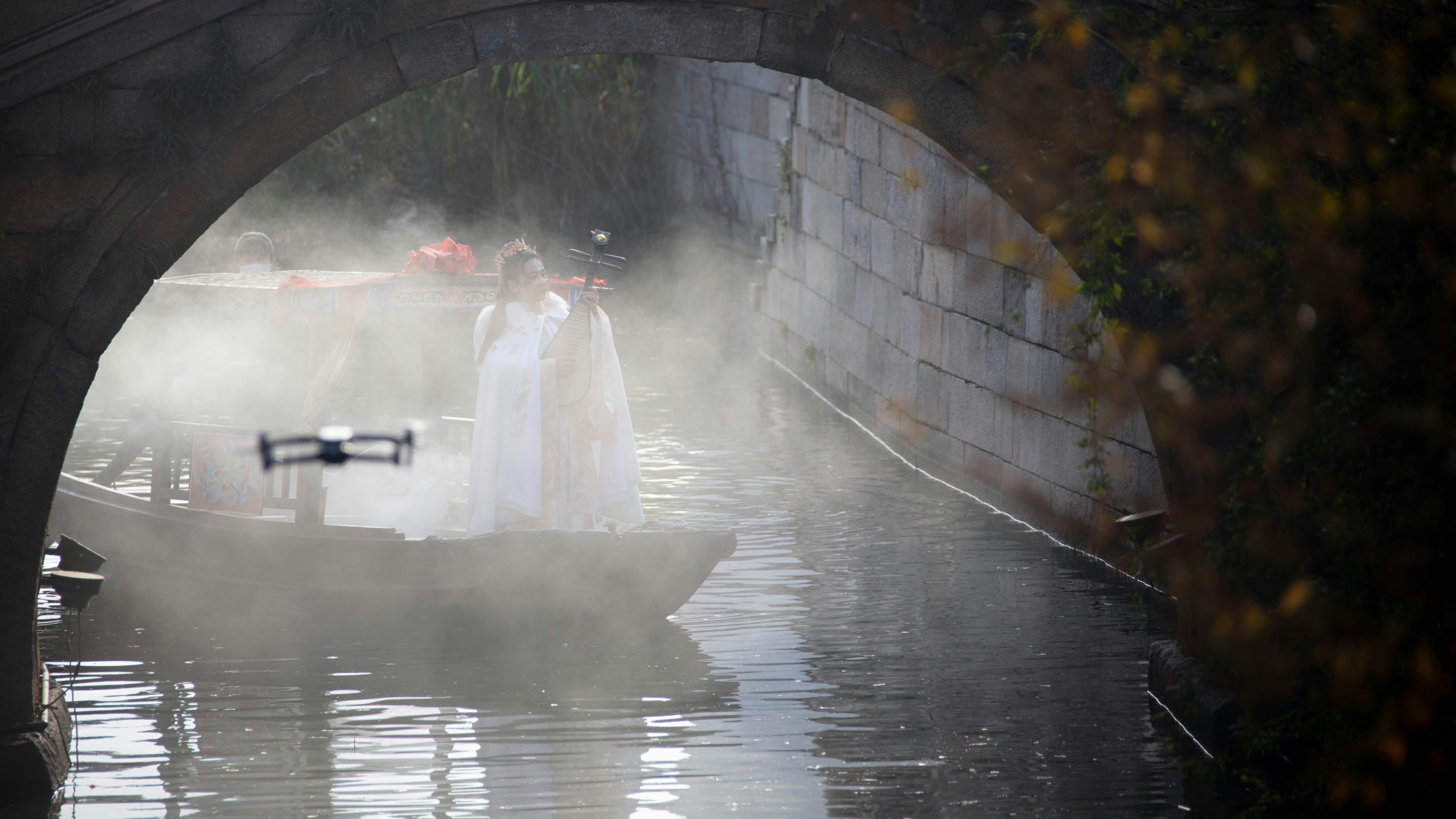 Mist-enshrouded Ceremony Afloat under the Stone Arch