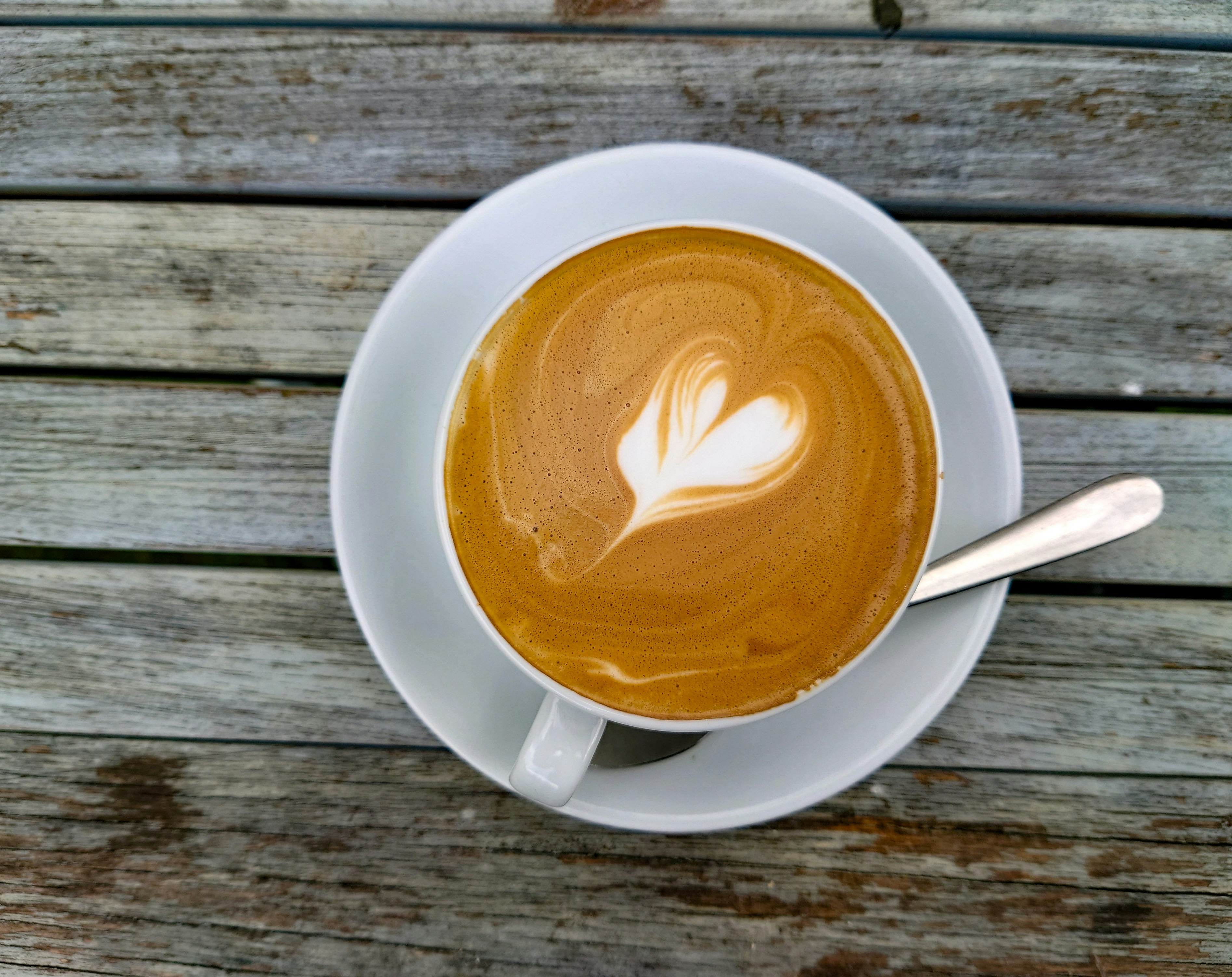 Latte Heartbeat on Weathered Wood