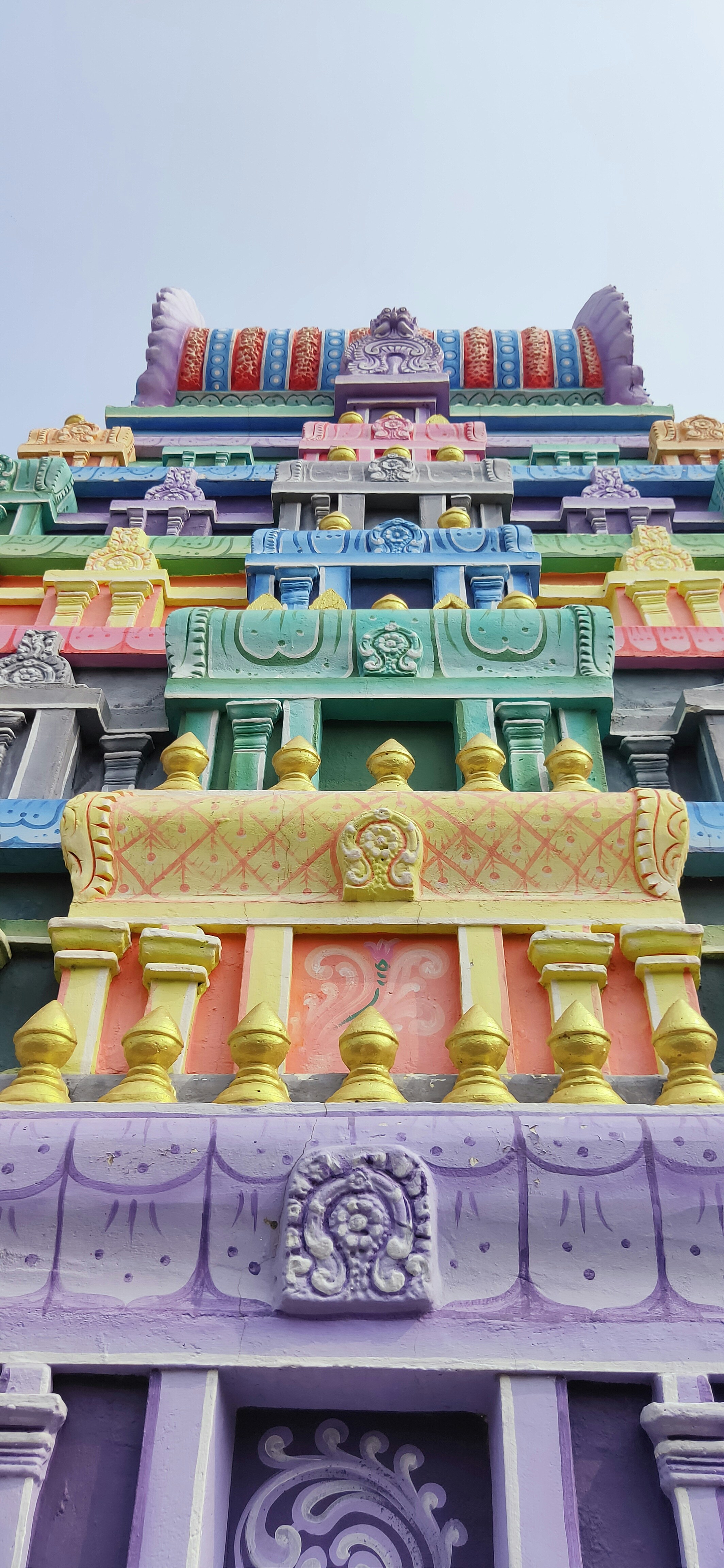 Rainbow Ascension: A Multicolored Temple Frieze Reaches for the Sky