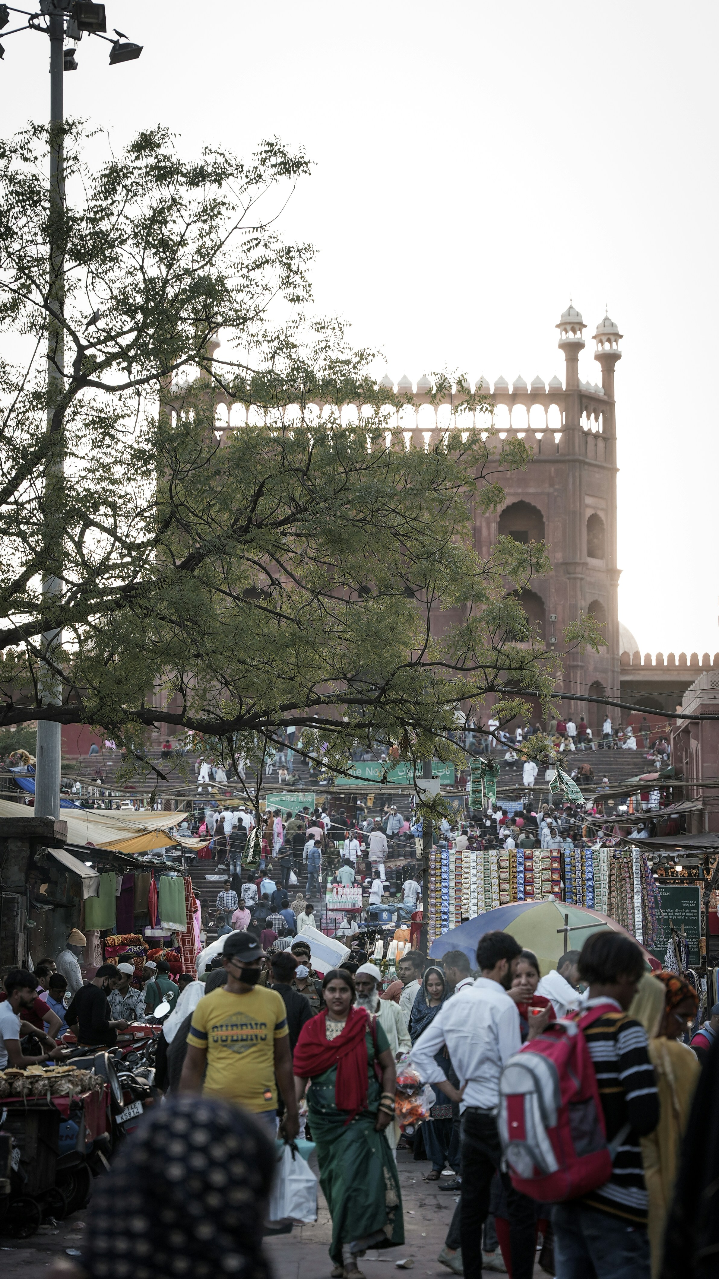 A crowd of people walking around a market photo – Free India Image on ...