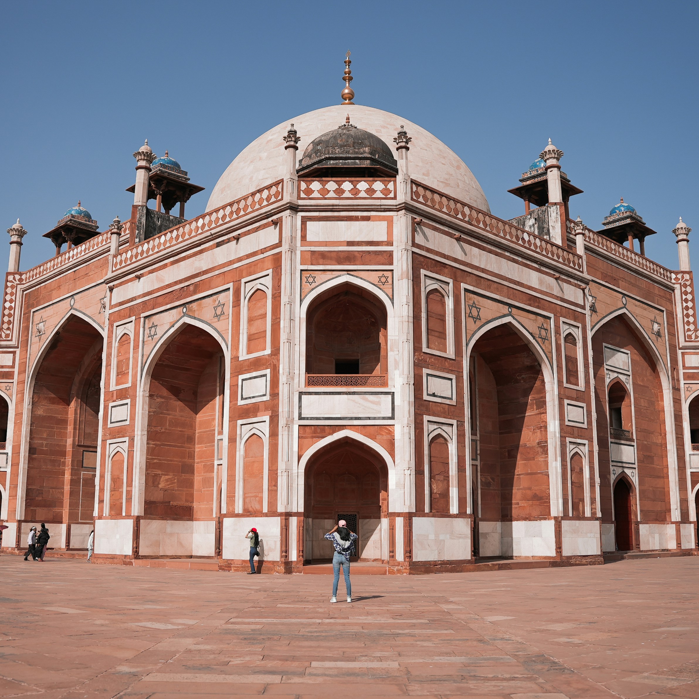 A person standing in front of a building photo – Free Humayun's tomb ...