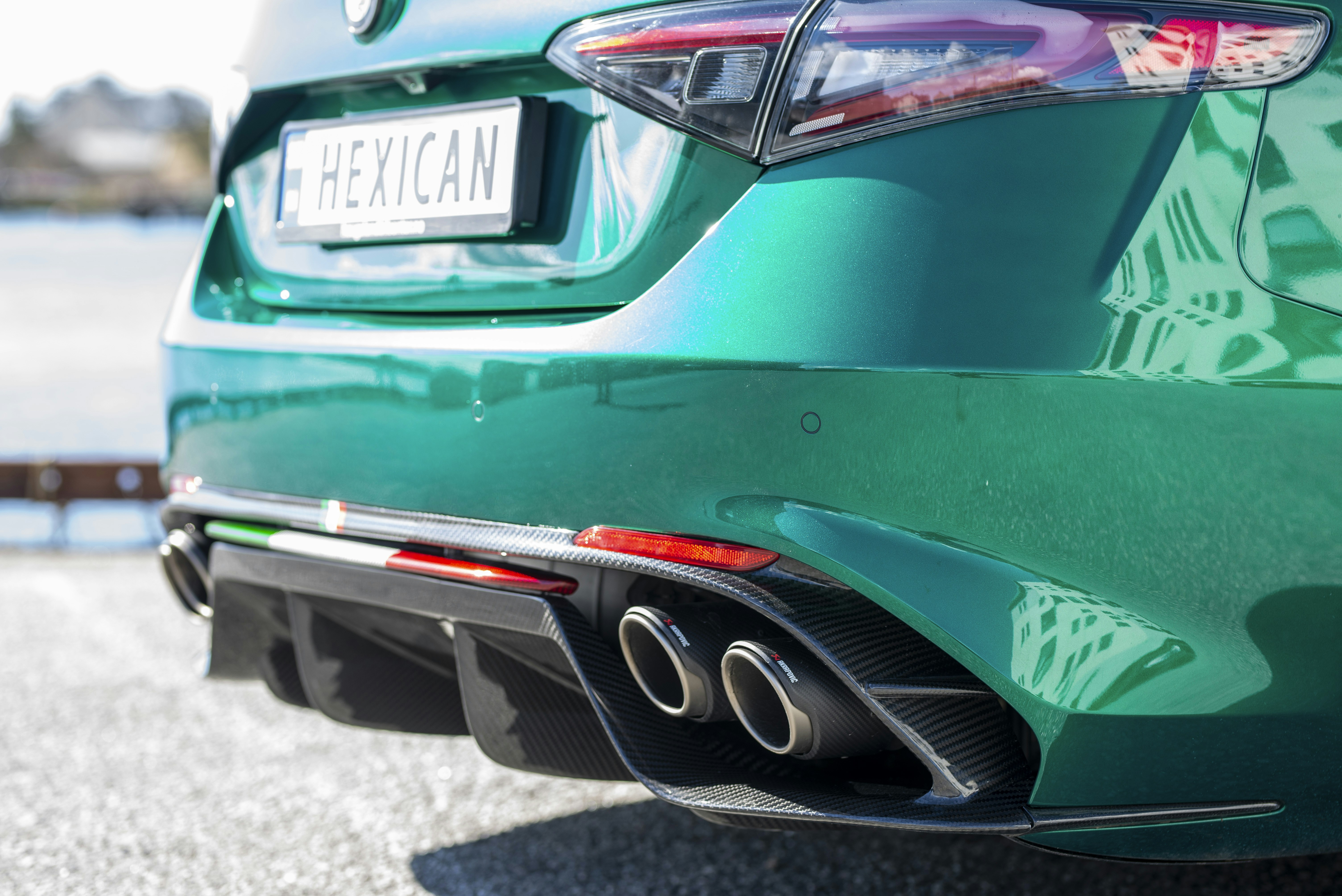 The rear end of a green sports car photo – Free Blue Image on Unsplash