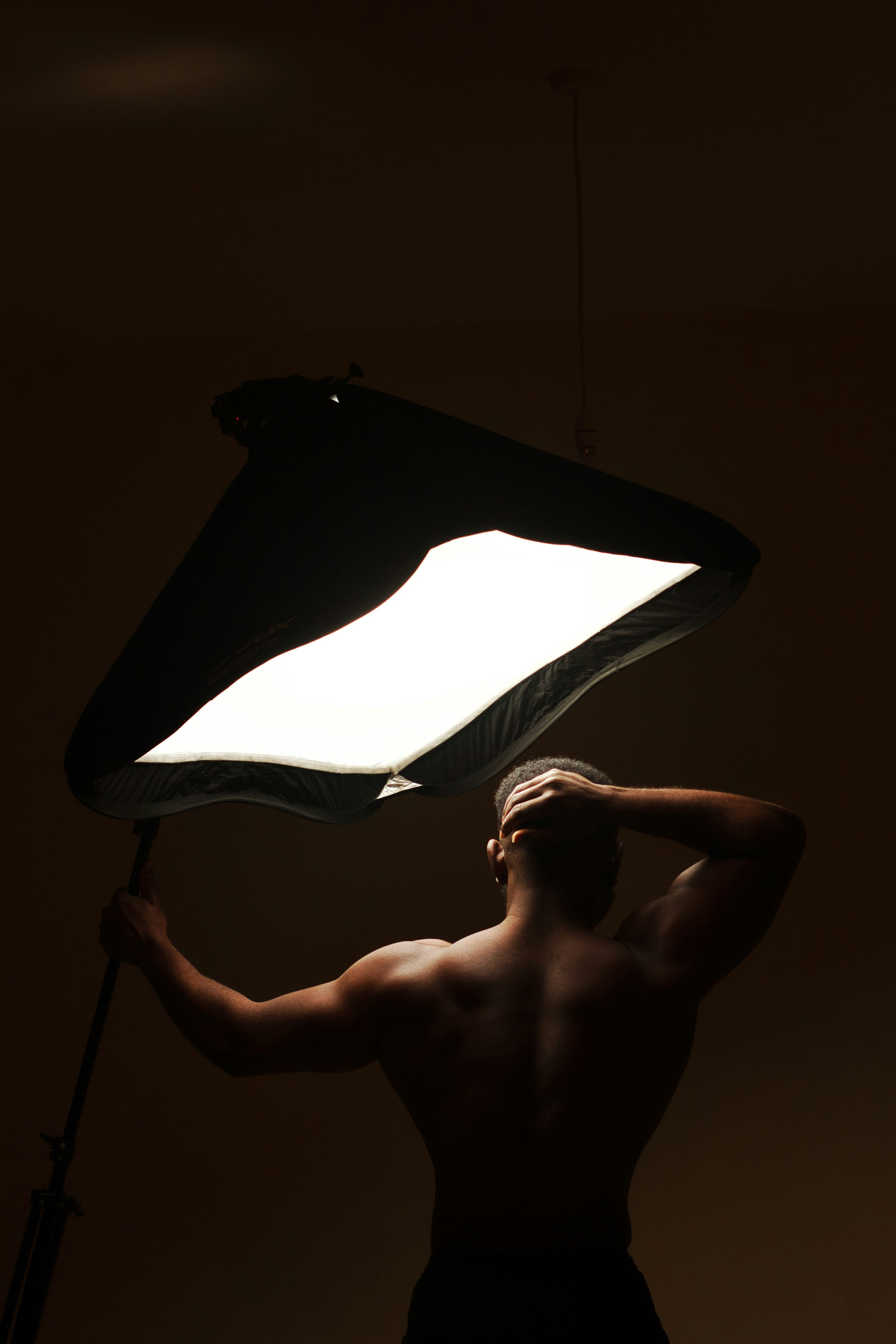 Under the Giant Softbox: A Muscular Studio Portrait