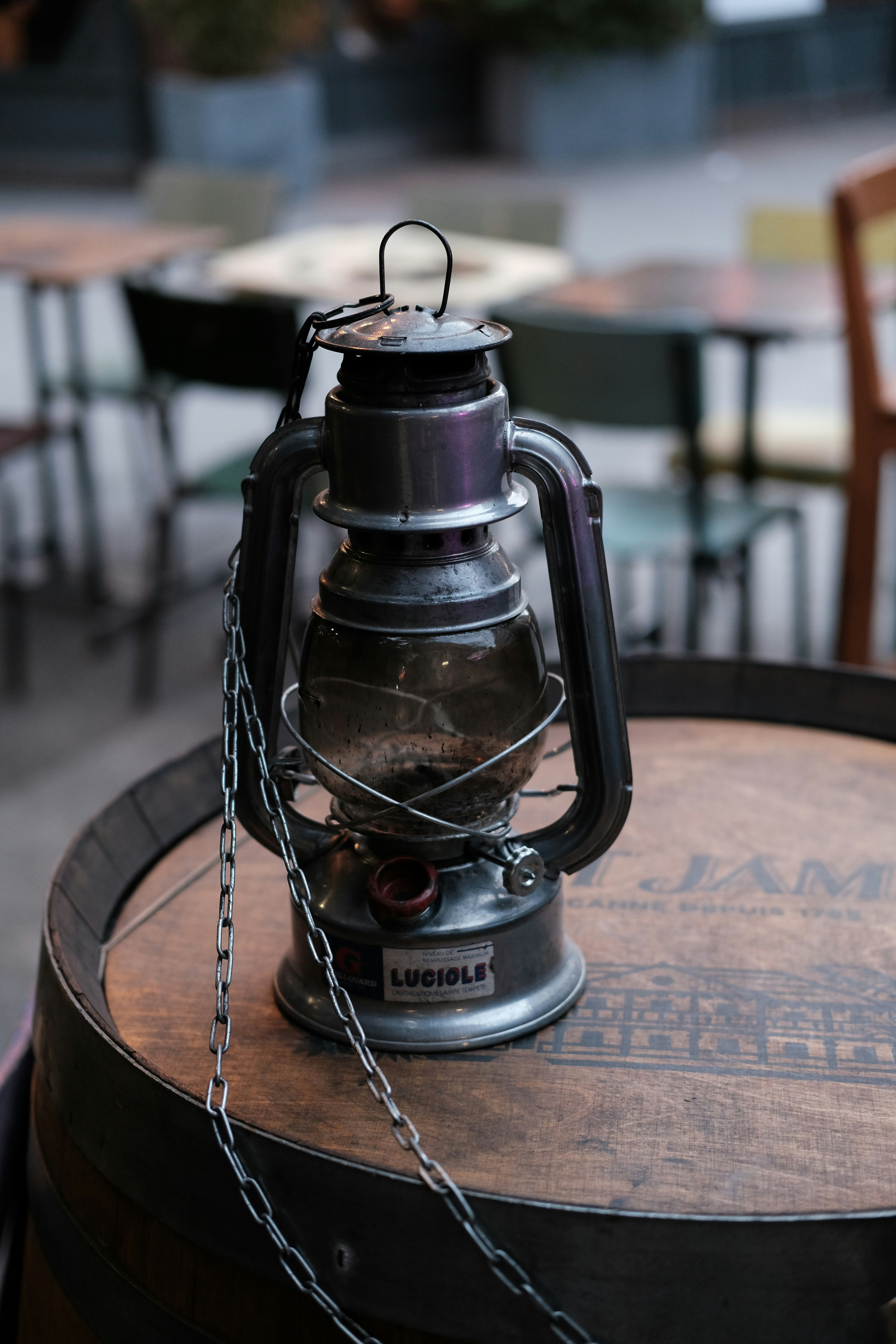 A lantern sitting on top of a wooden barrel photo – Free Paris Image on ...