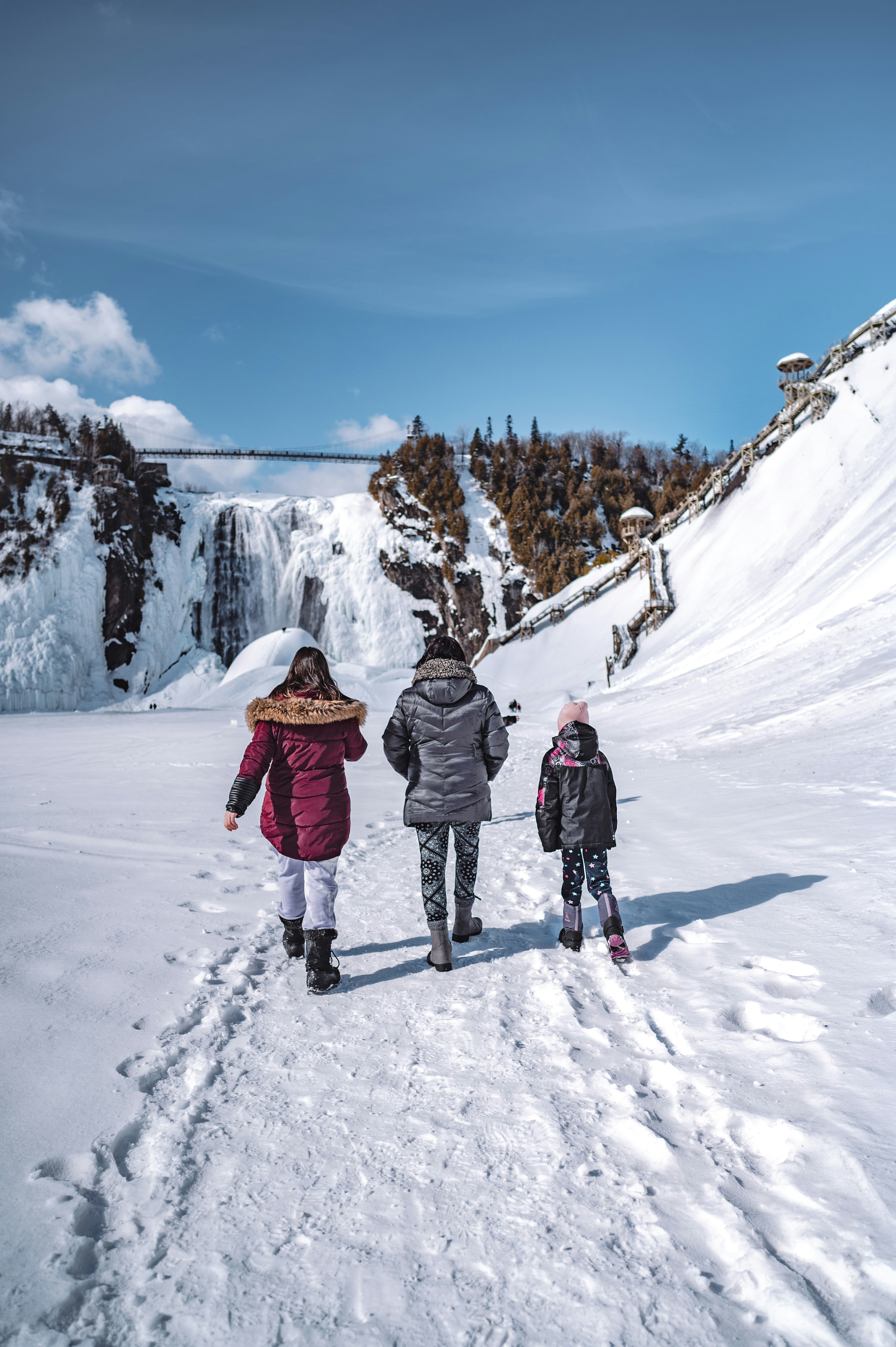 Snowbound Ascent: A Family Trek Toward the Frozen Waterfall
