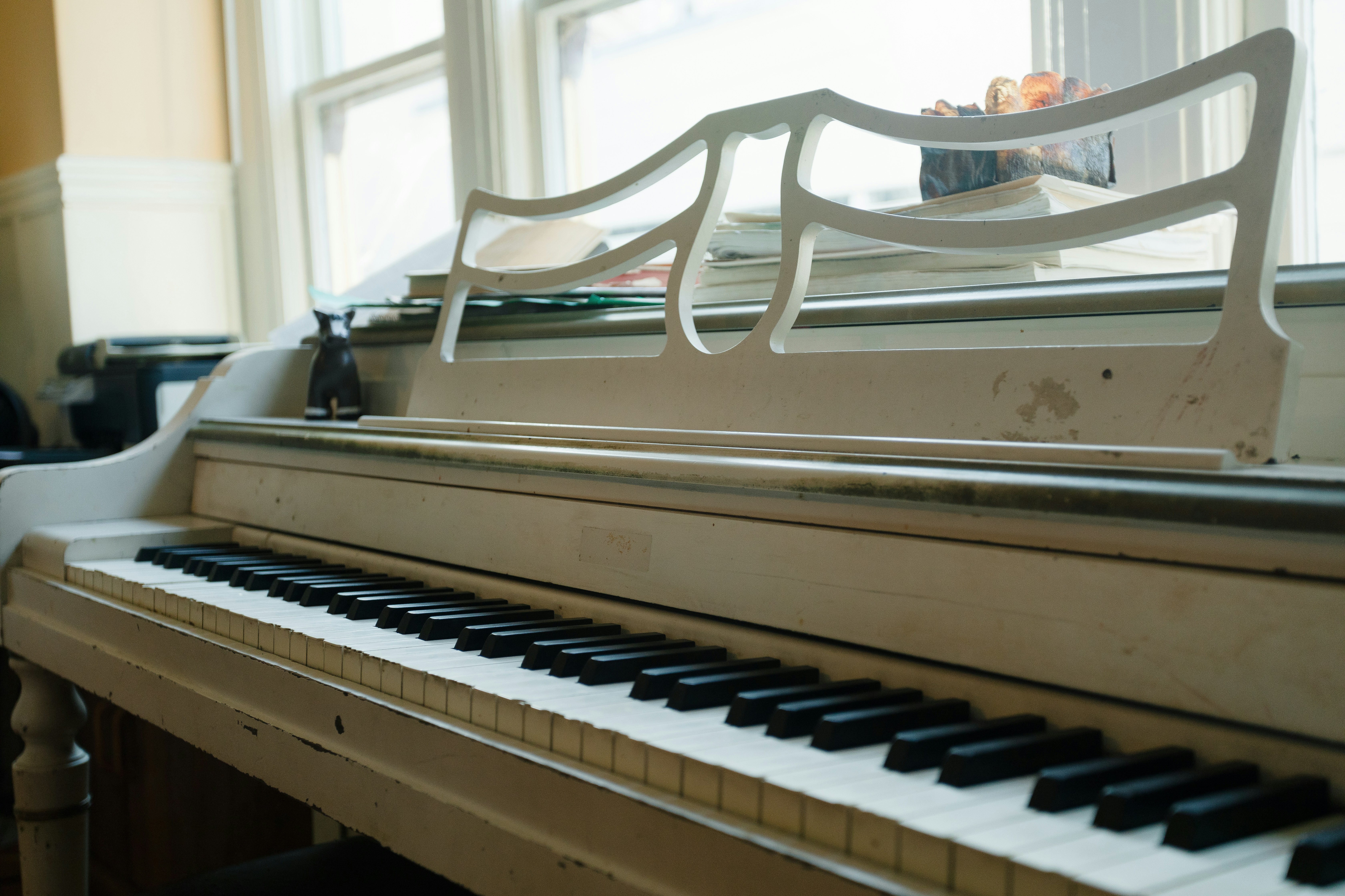 A close up of a piano near a window photo – Free Piano Image on Unsplash