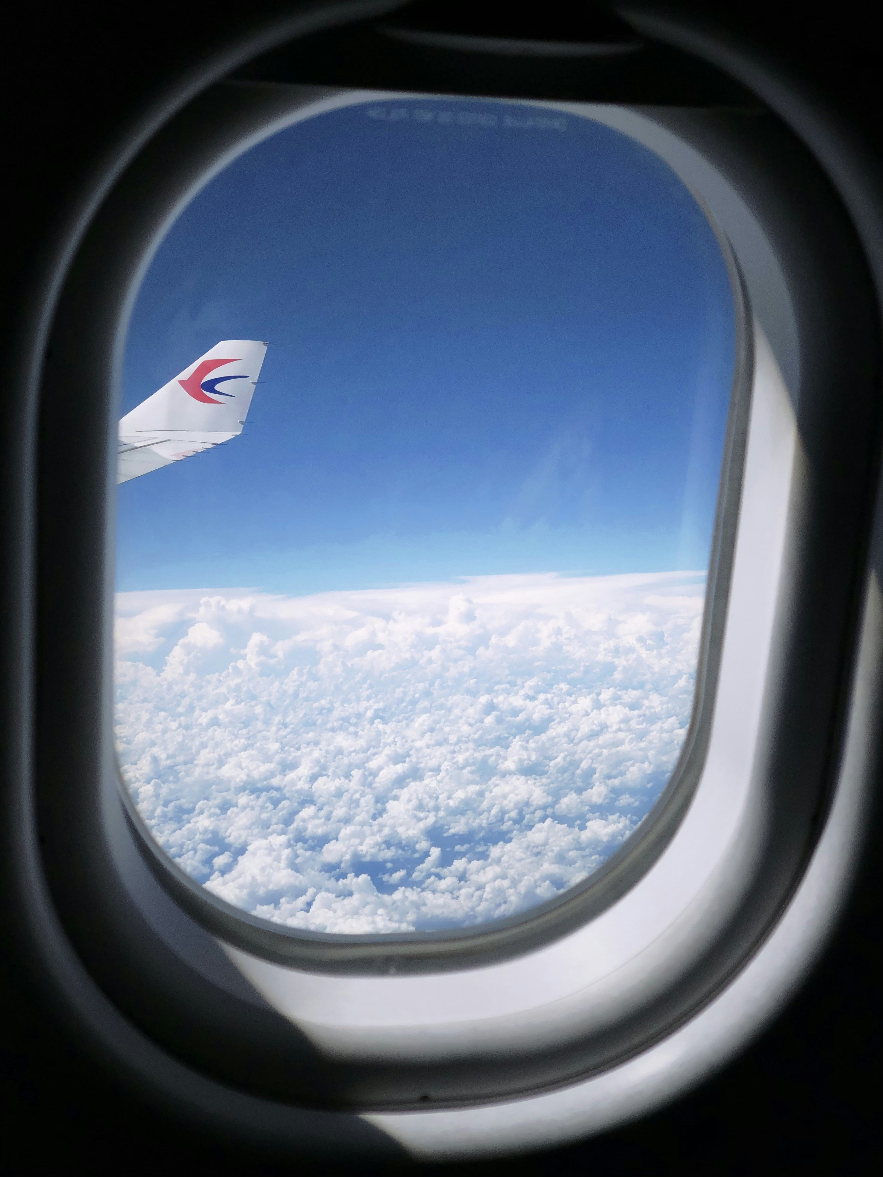 A view of the wing of an airplane through a window photo – Free Car ...