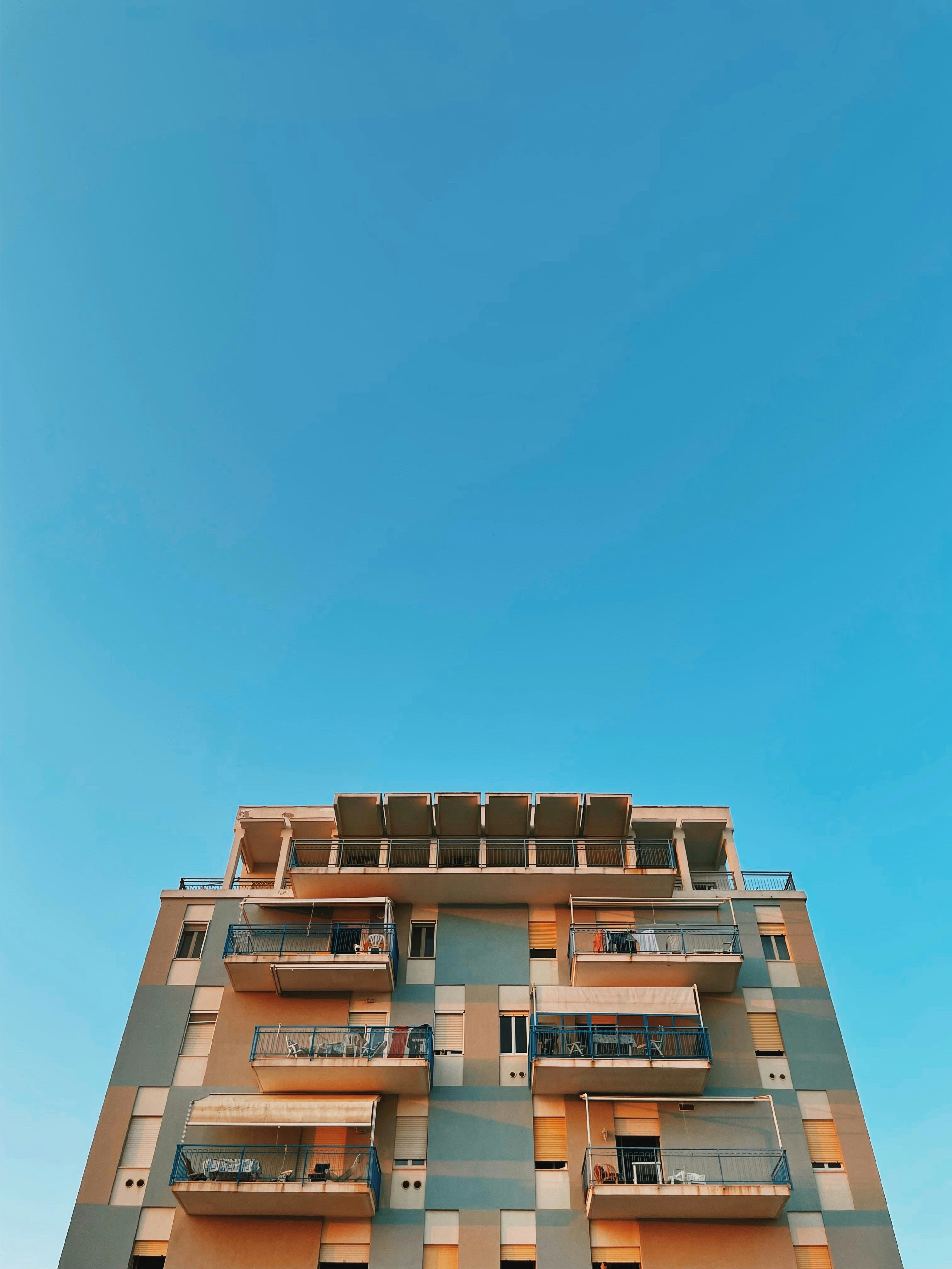 Cerulean Sky Framing a Tiered City Block