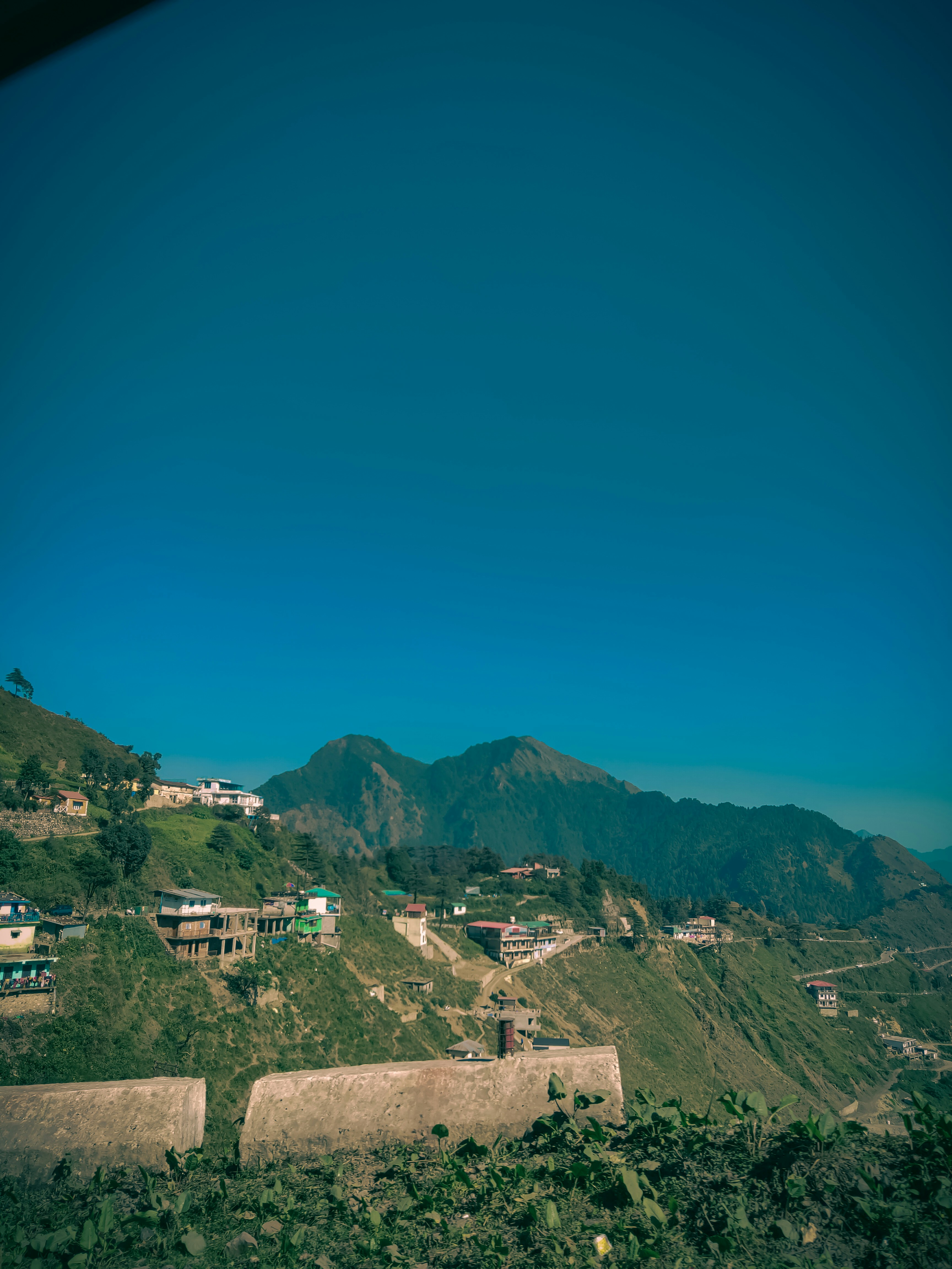 Terraced ridge: hillside hamlets under a cobalt sky