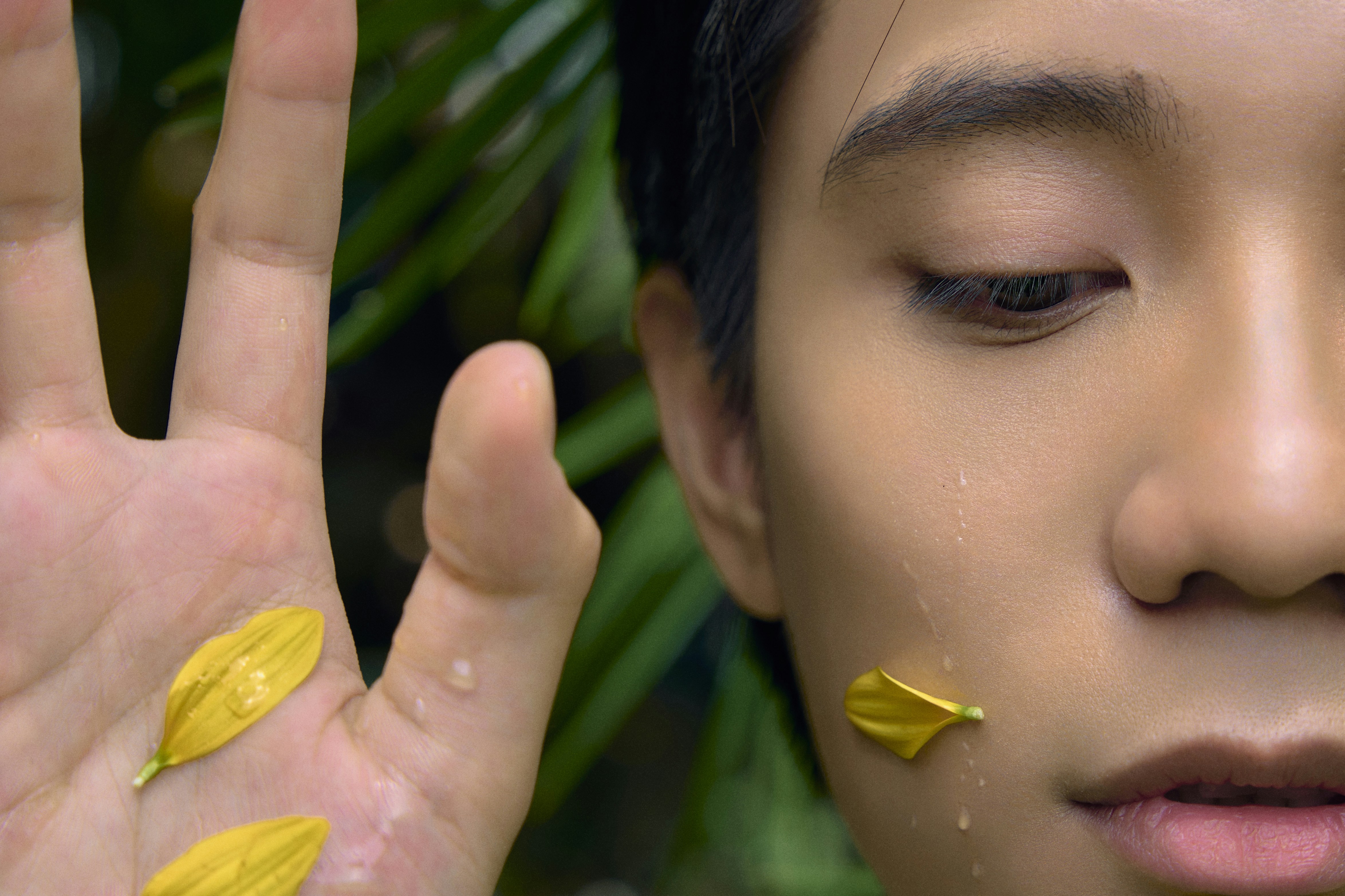 Petals on the Palm: a Quiet Close-Up Between Skin and Leaves