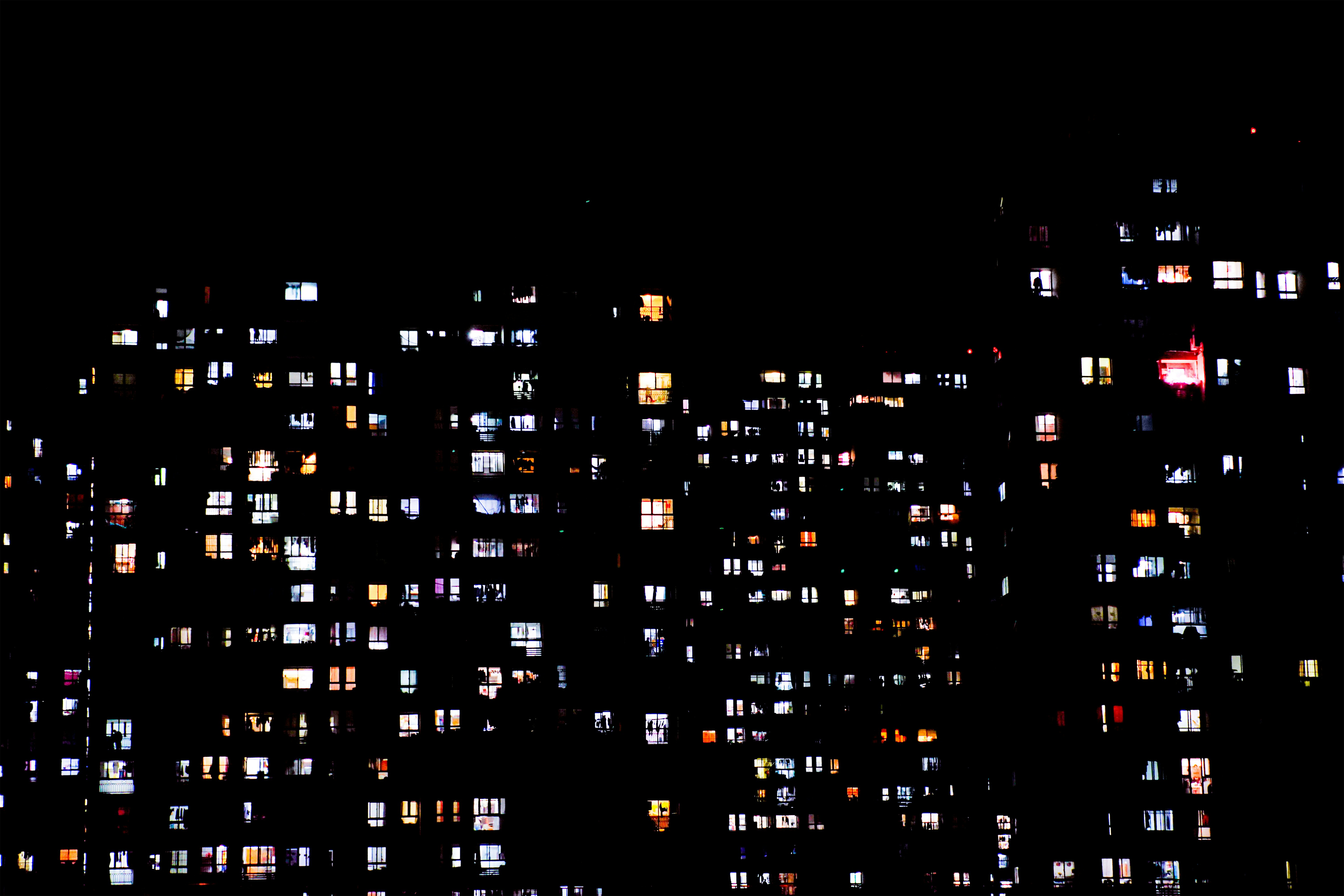 A night view of a city with lots of windows photo – Free Building Image ...