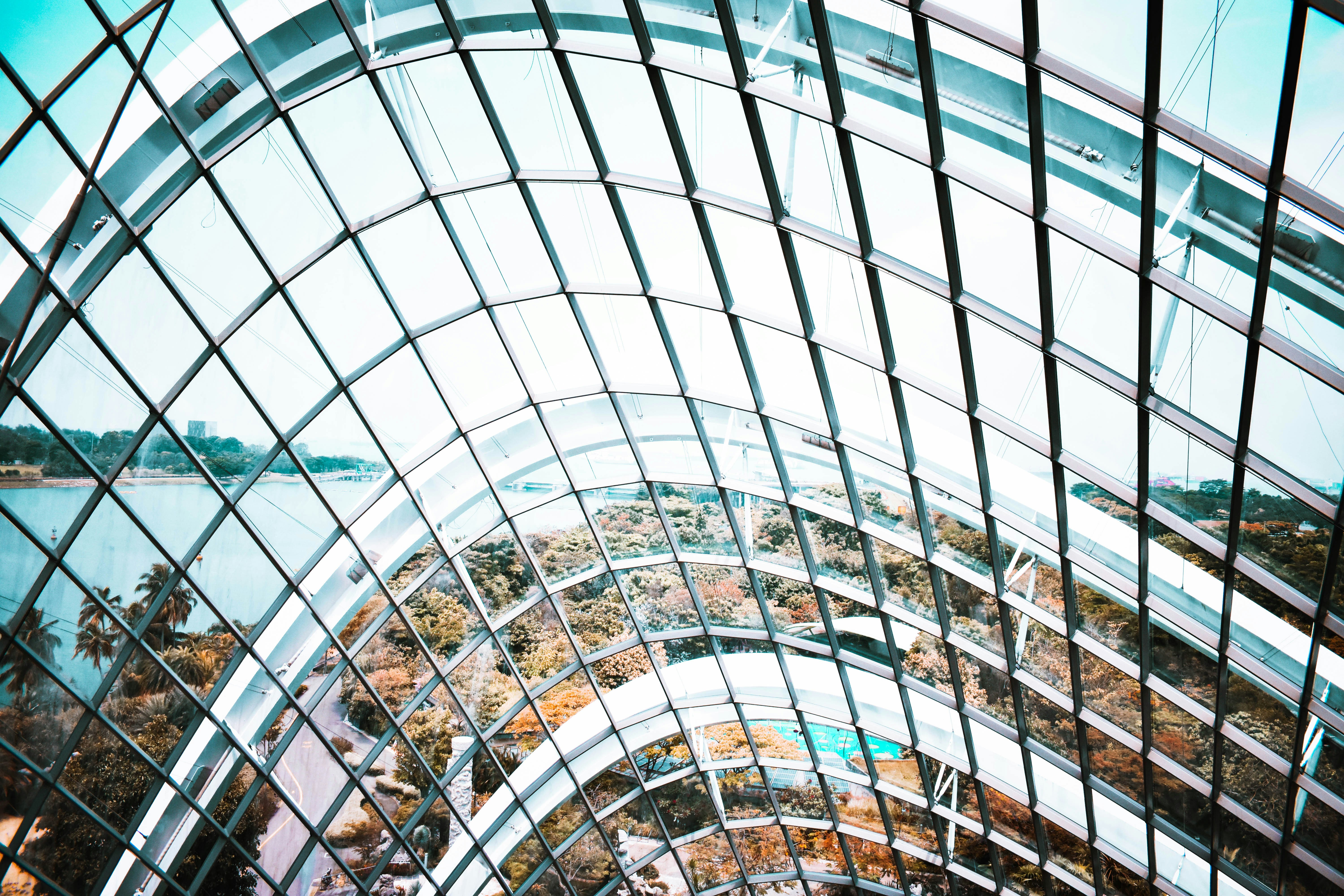 A view from inside a building looking down at a body of water photo ...