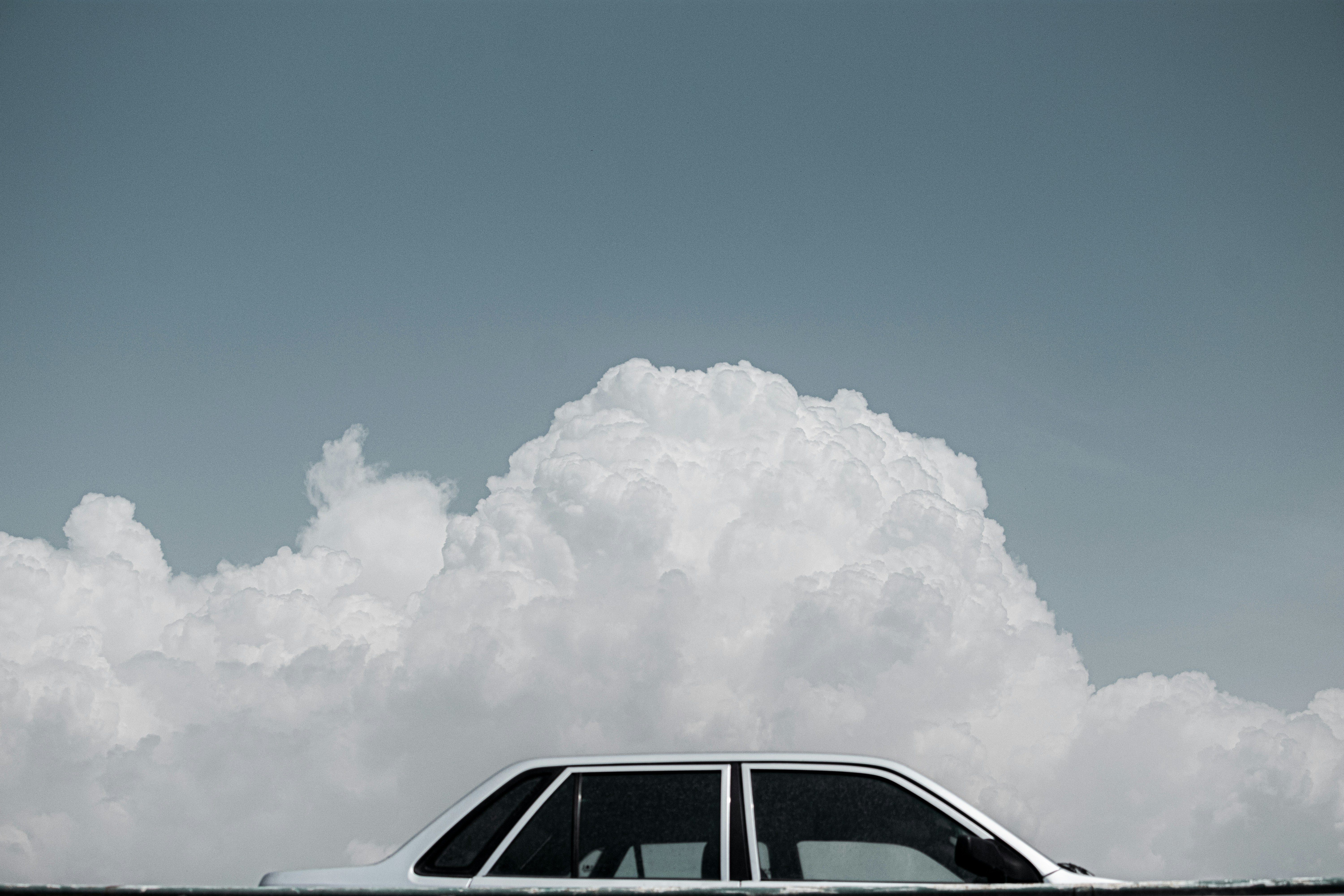 A black and white photo of a car in front of a cloud photo – Free Grey ...