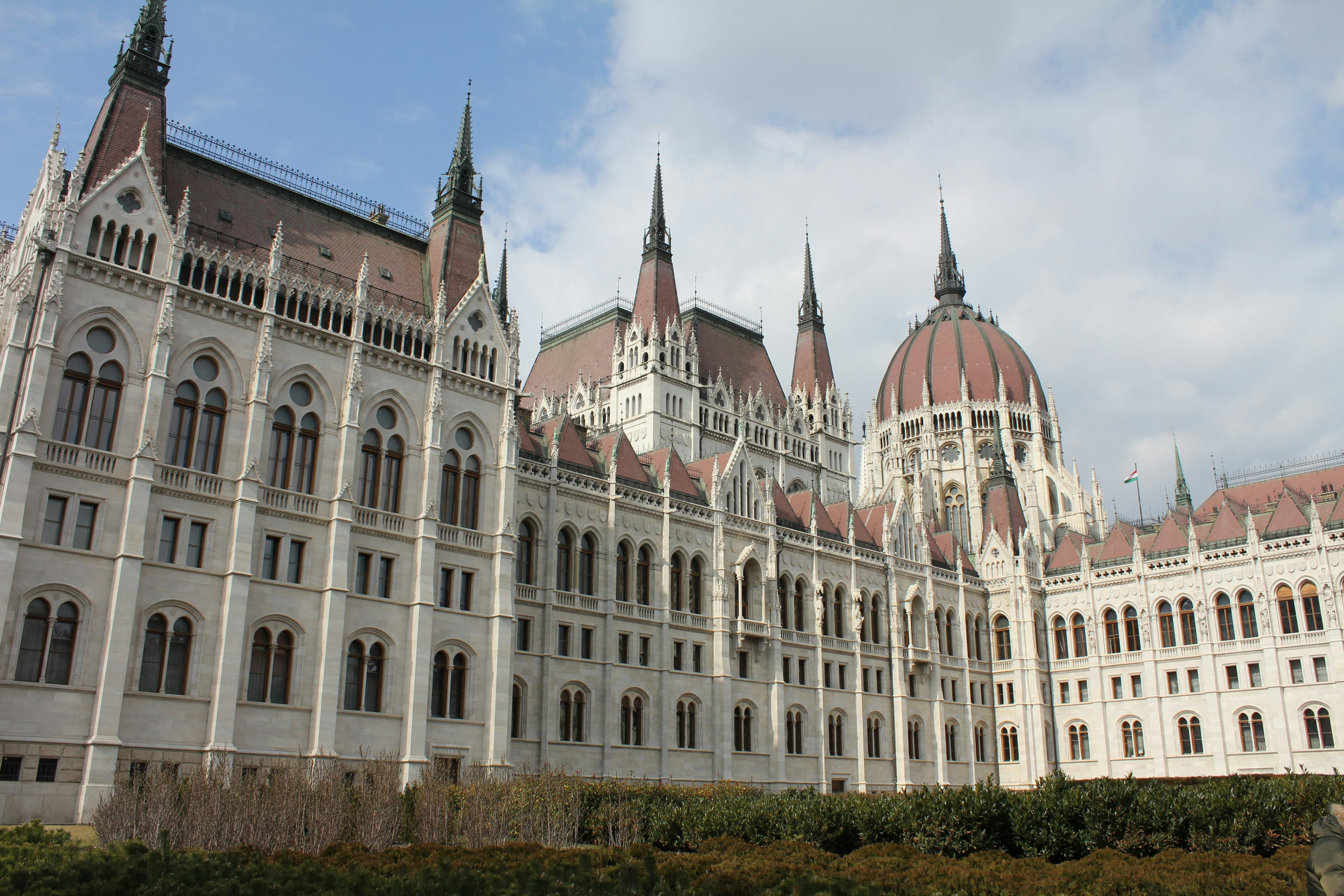 A large white building with many windows and towers photo – Free ...