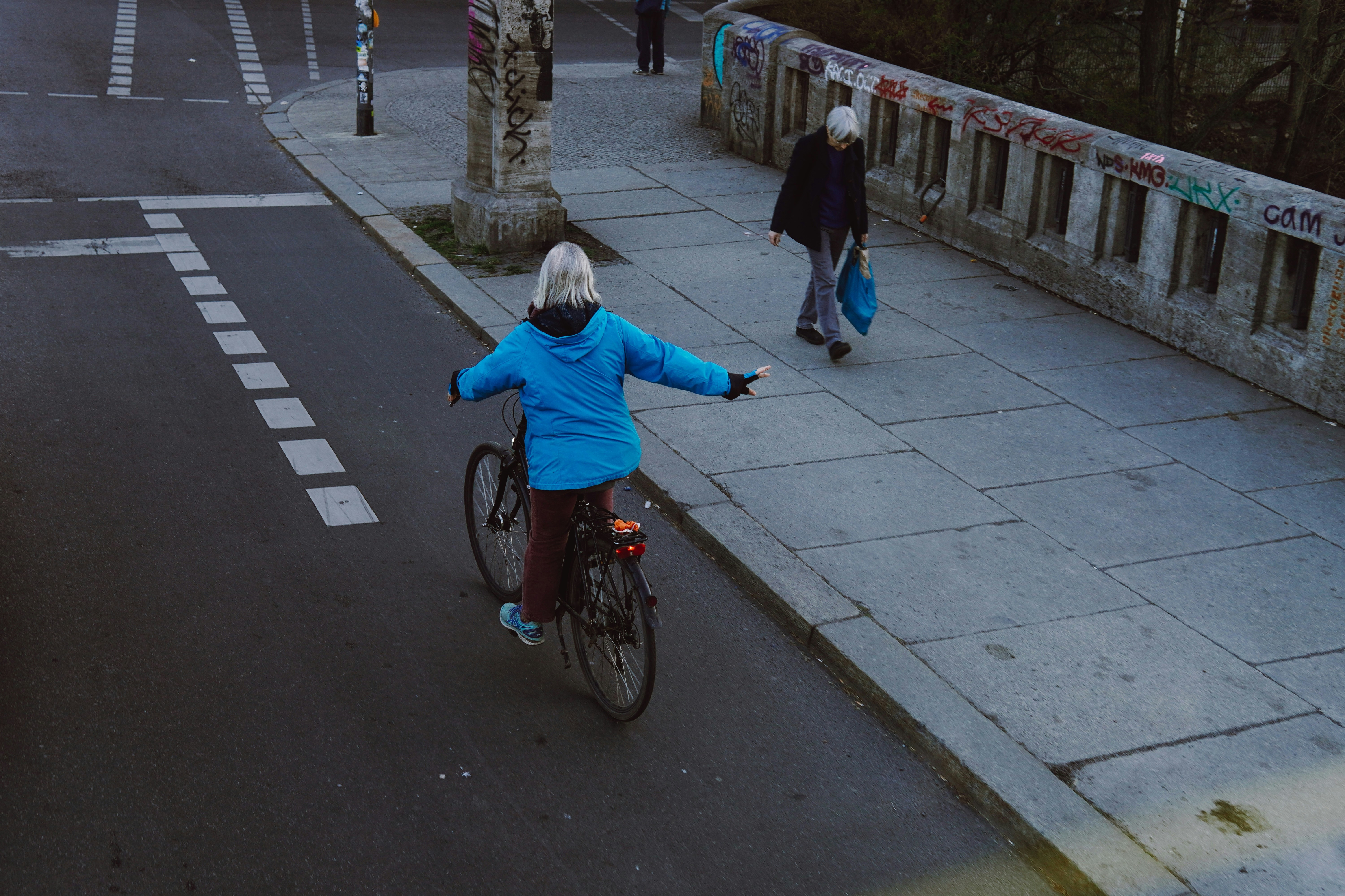 a woman riding a bike down a streetVictoria Prymak
