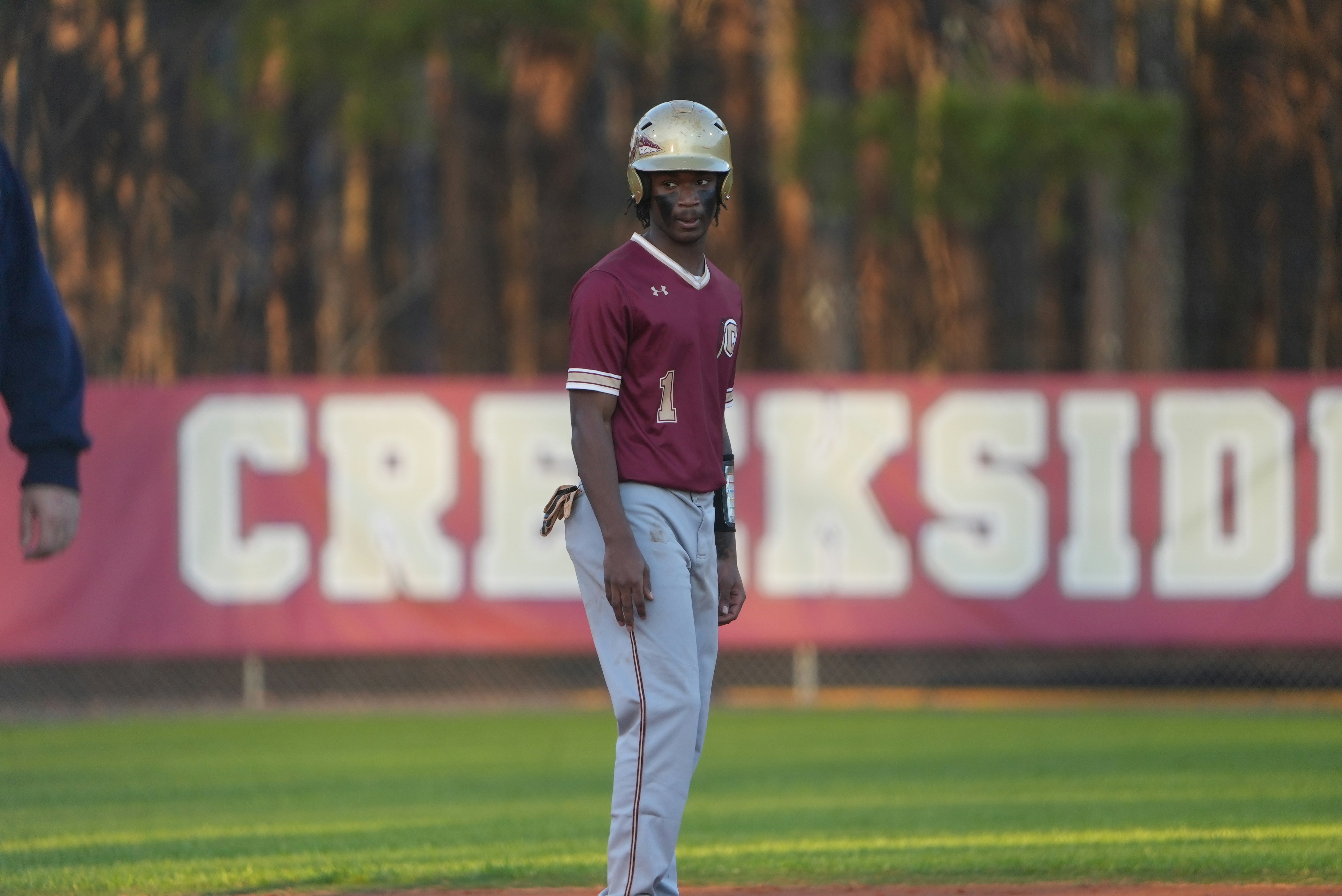 A baseball player standing on a baseball field photo – Free Baseball ...
