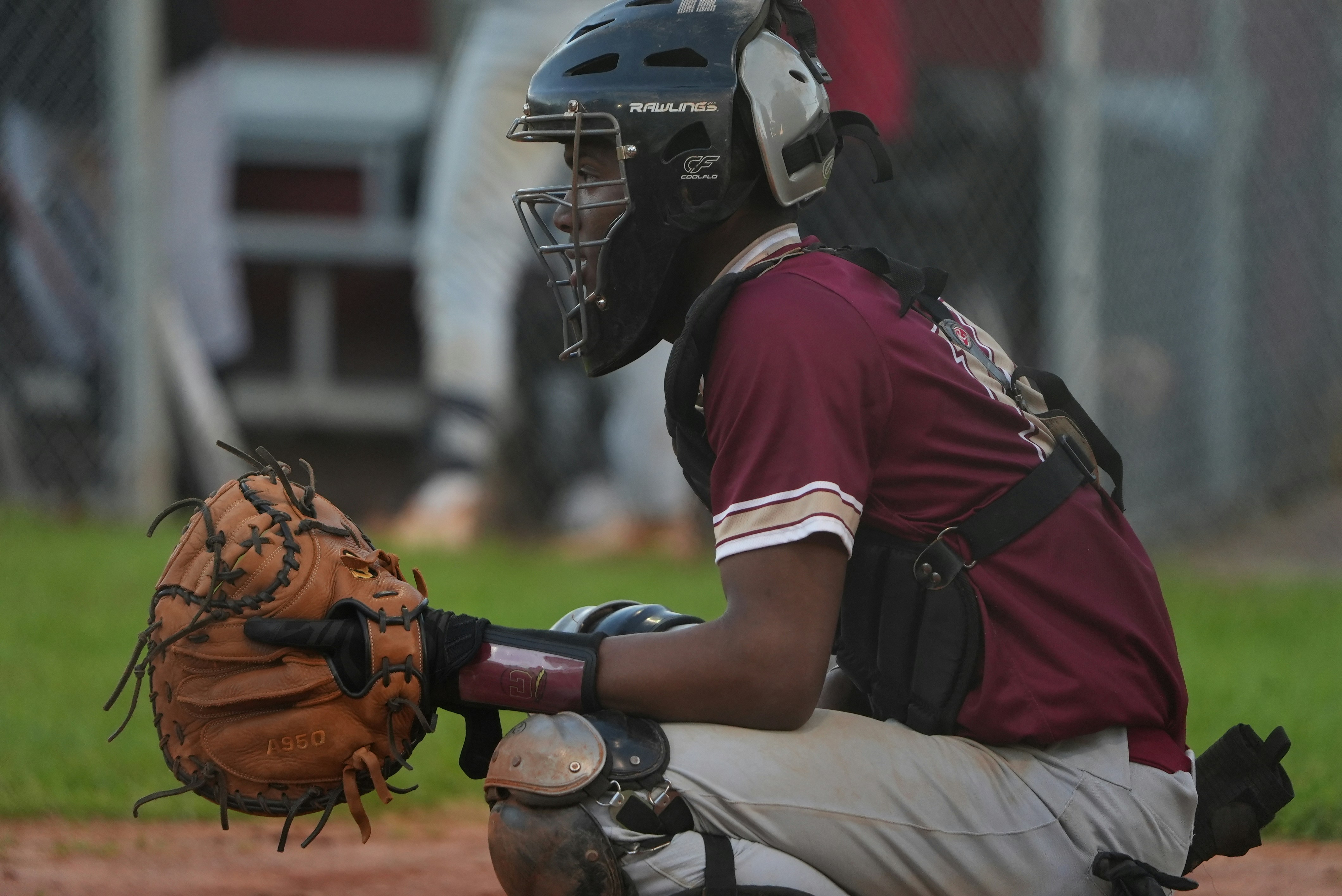 A baseball player with a catchers mitt on a field photo – Free Human ...