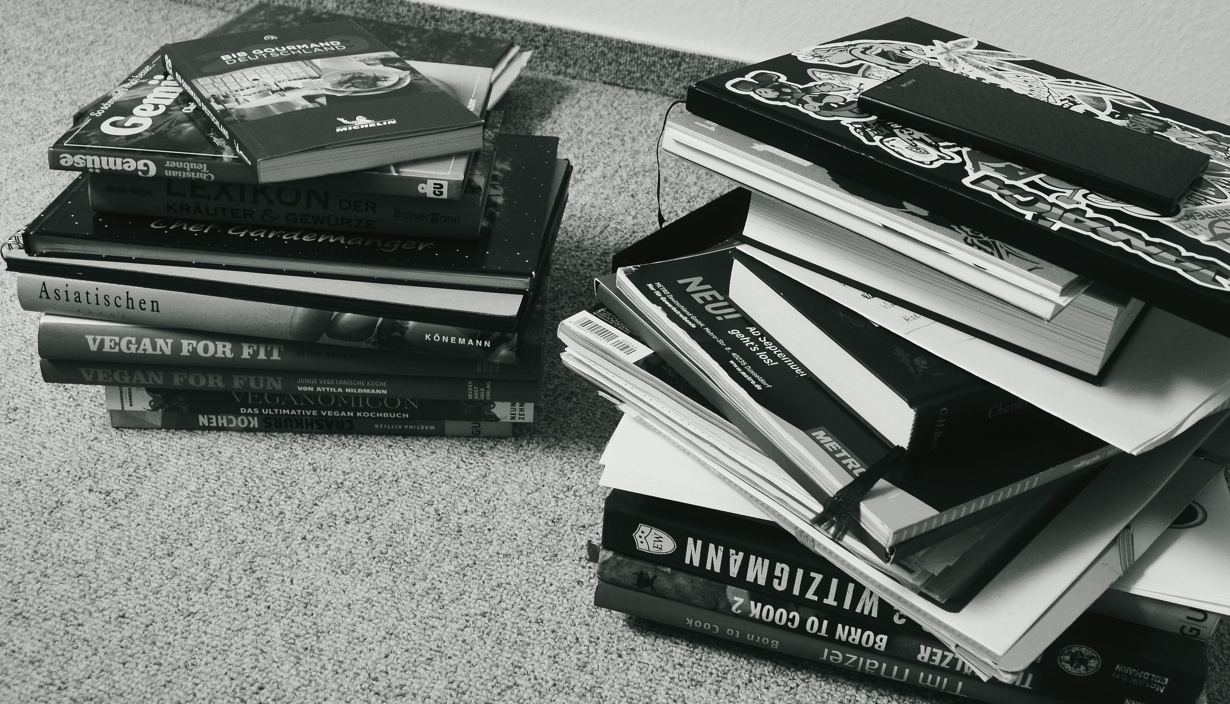 A pile of books sitting on top of a floor photo – Free Grey Image on ...