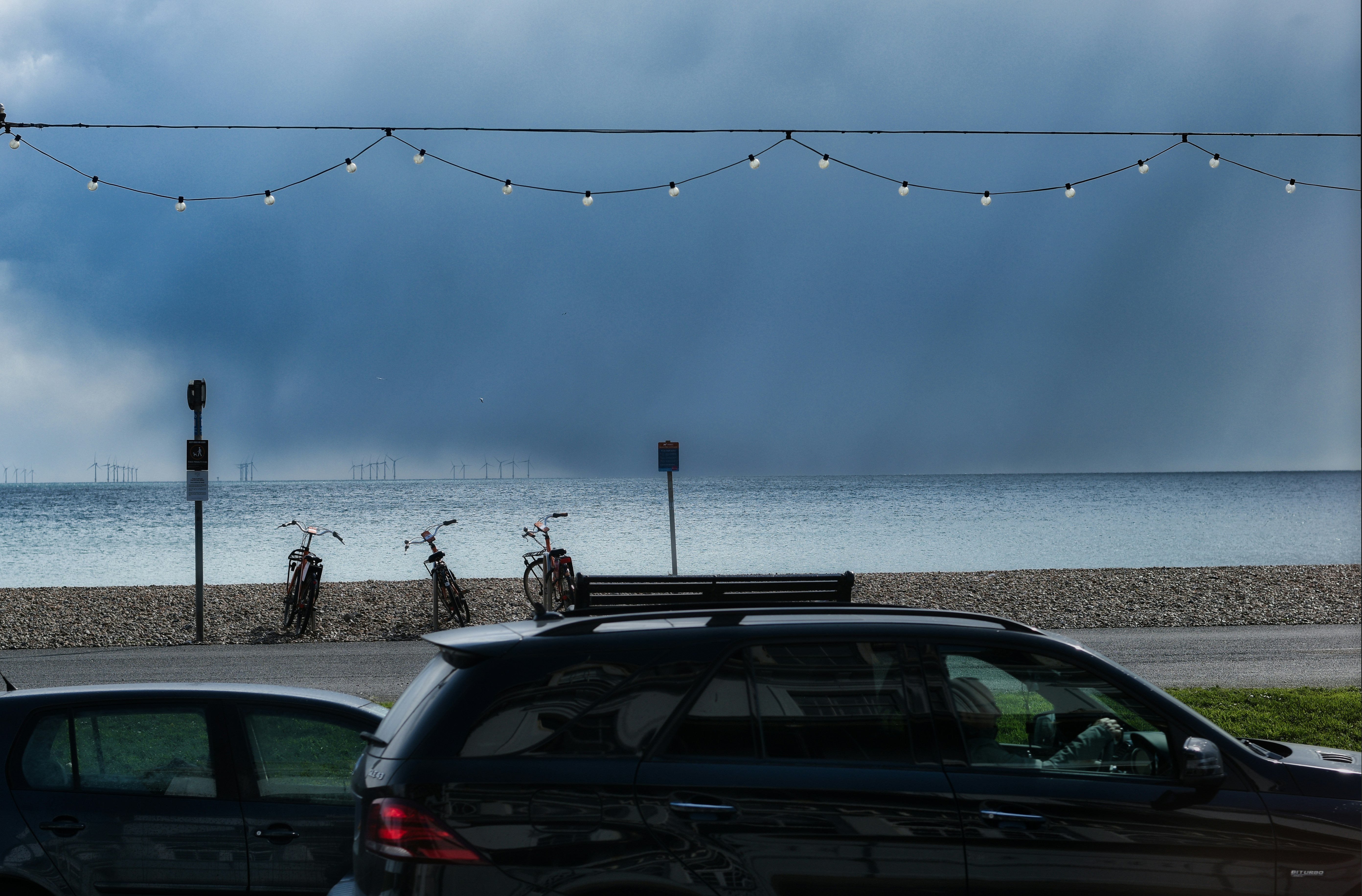 Coastal Commute Under Stormy Skies