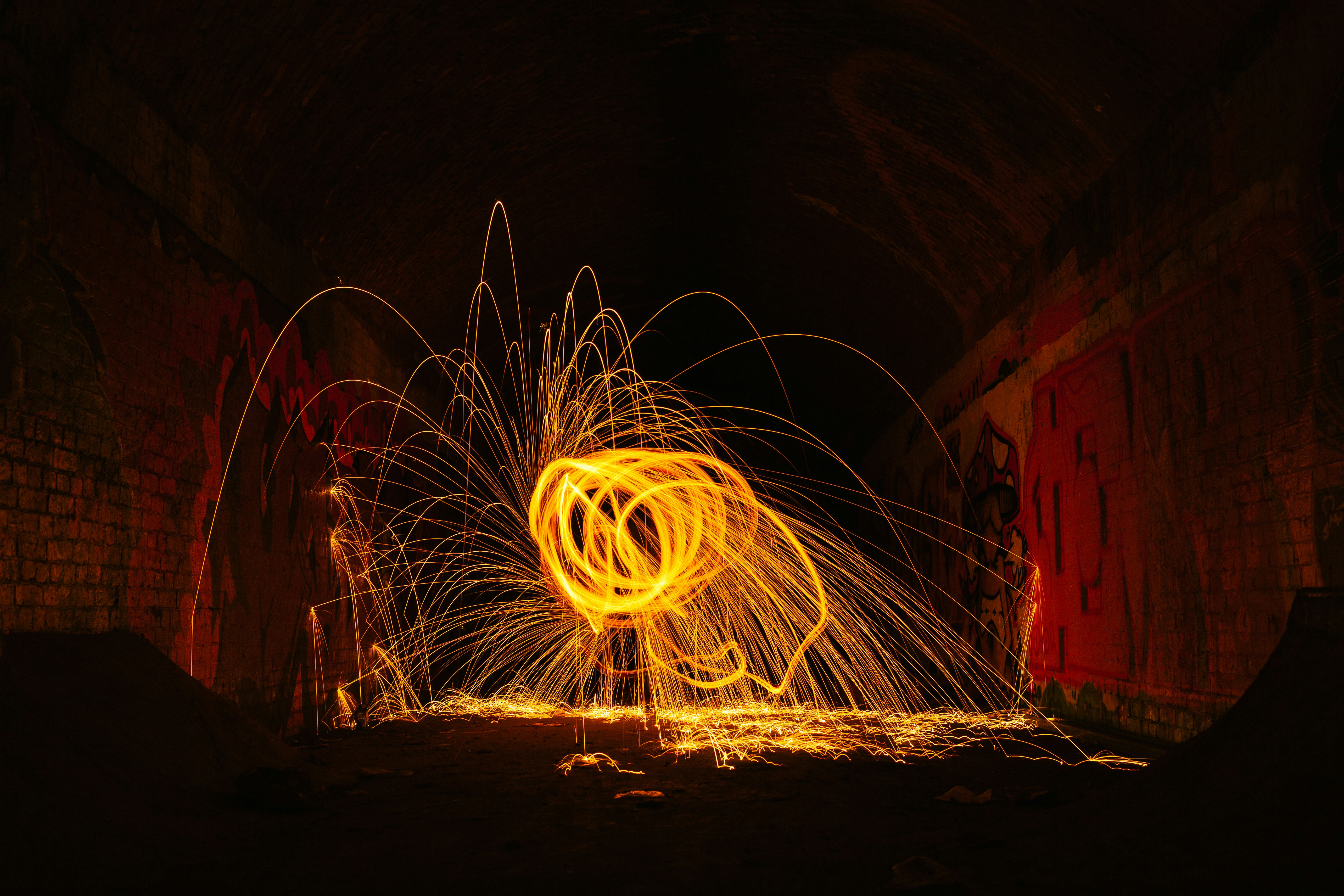 A man is spinning a fire hose in the dark photo – Free Fire Image on ...