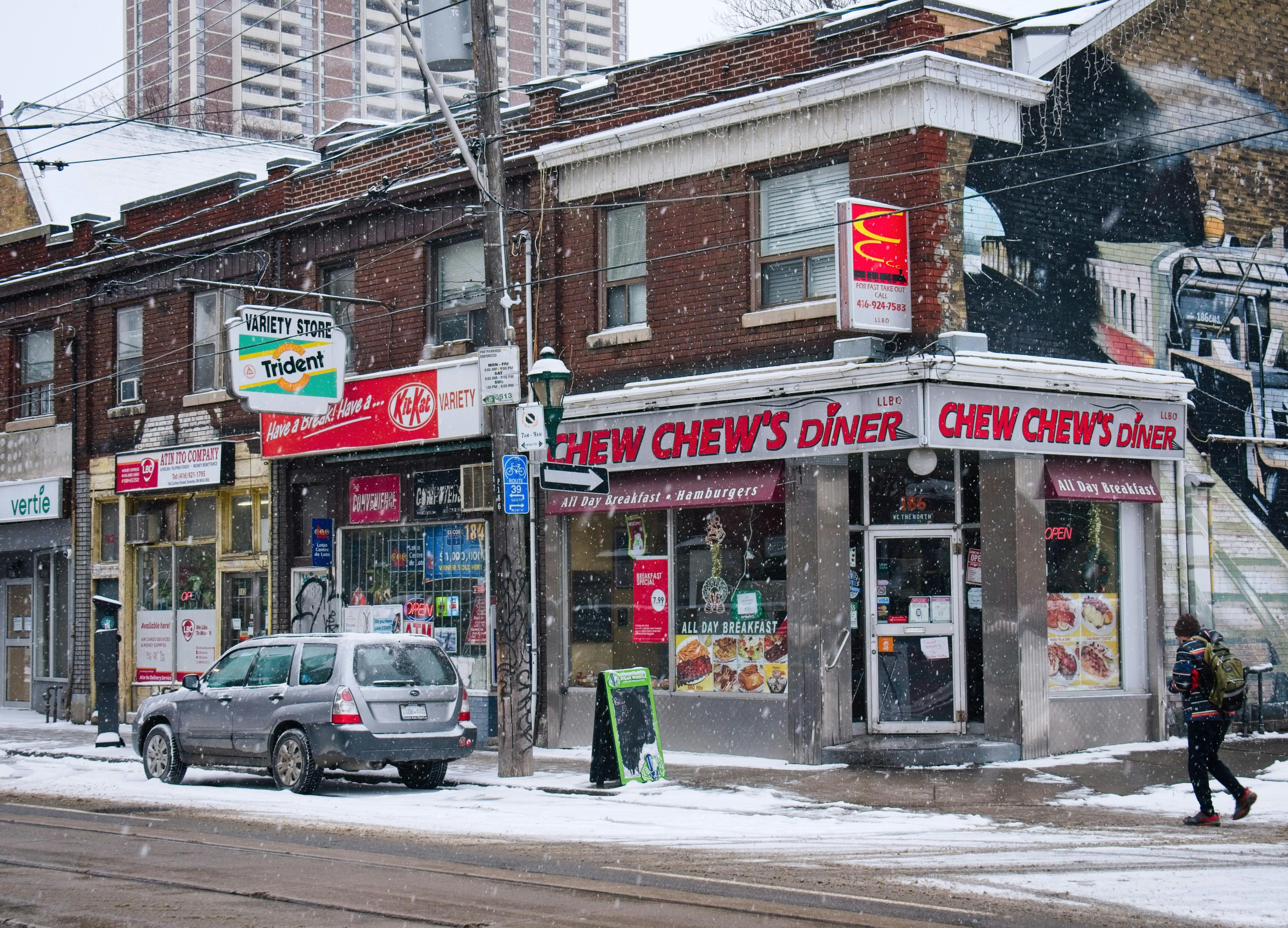 A car parked in front of a convenience store photo – Free Car Image on ...