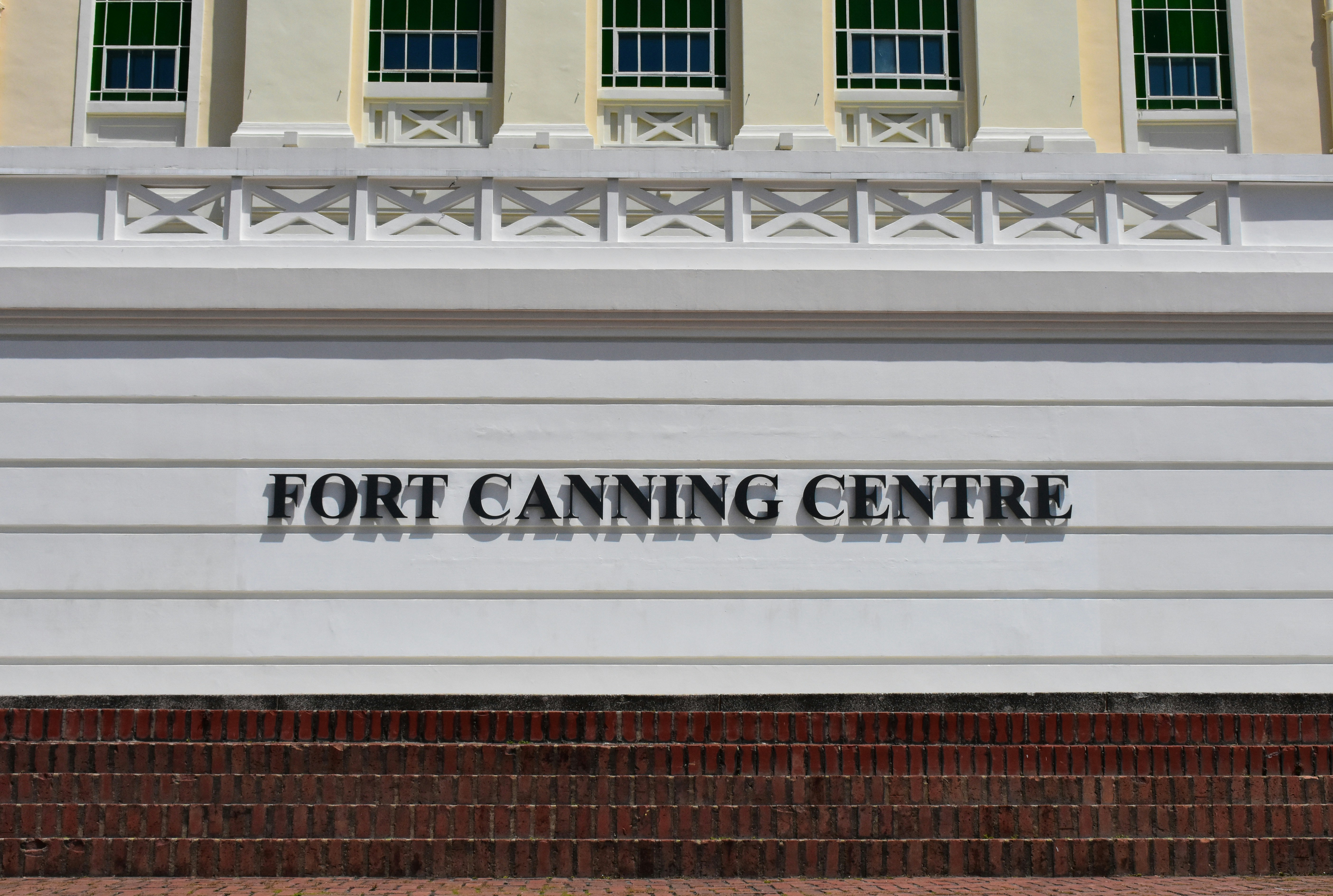 A sign on the side of a building that says fort canning centre photo ...
