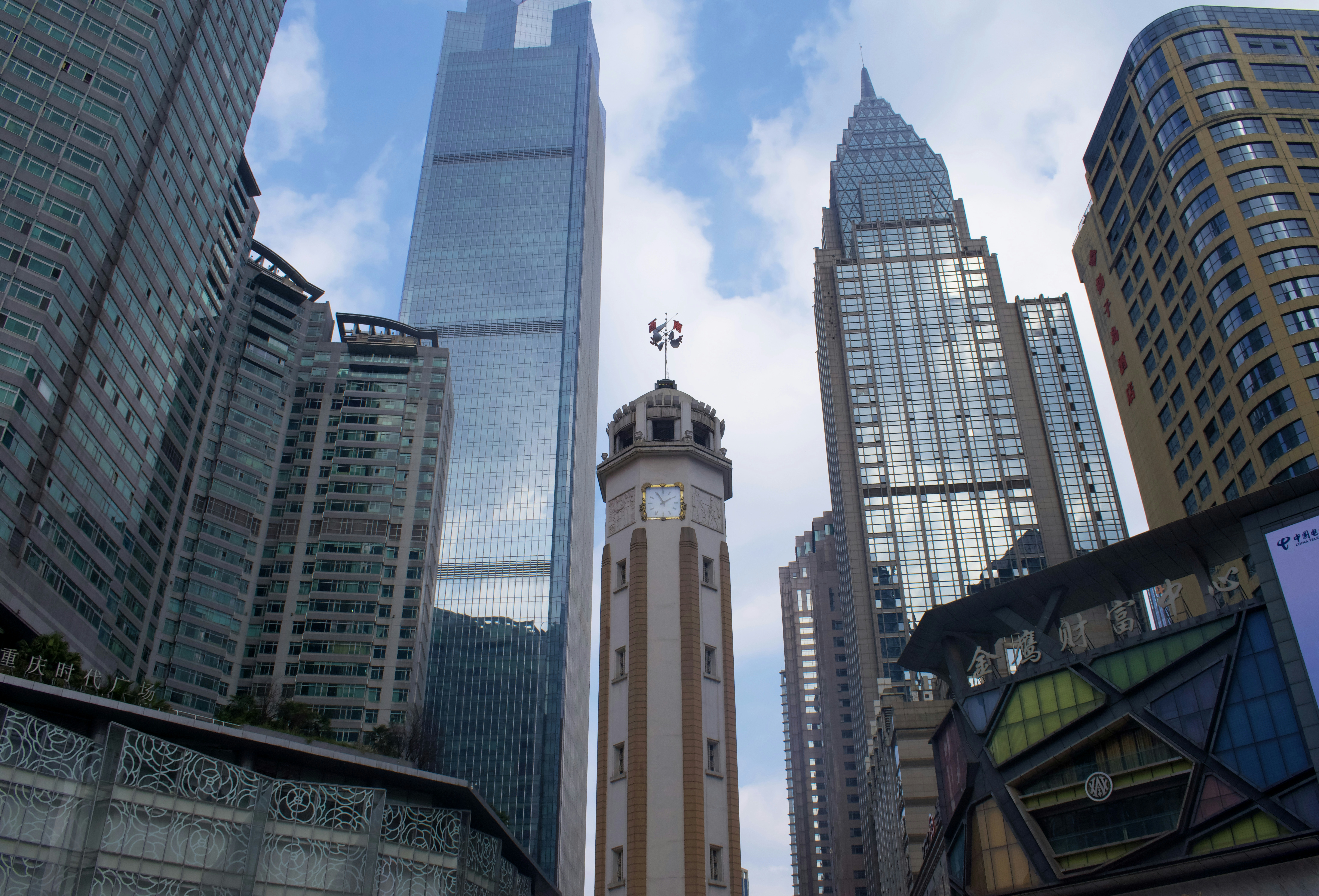 A tall clock tower towering over a city photo – Free Chongqing Image on ...