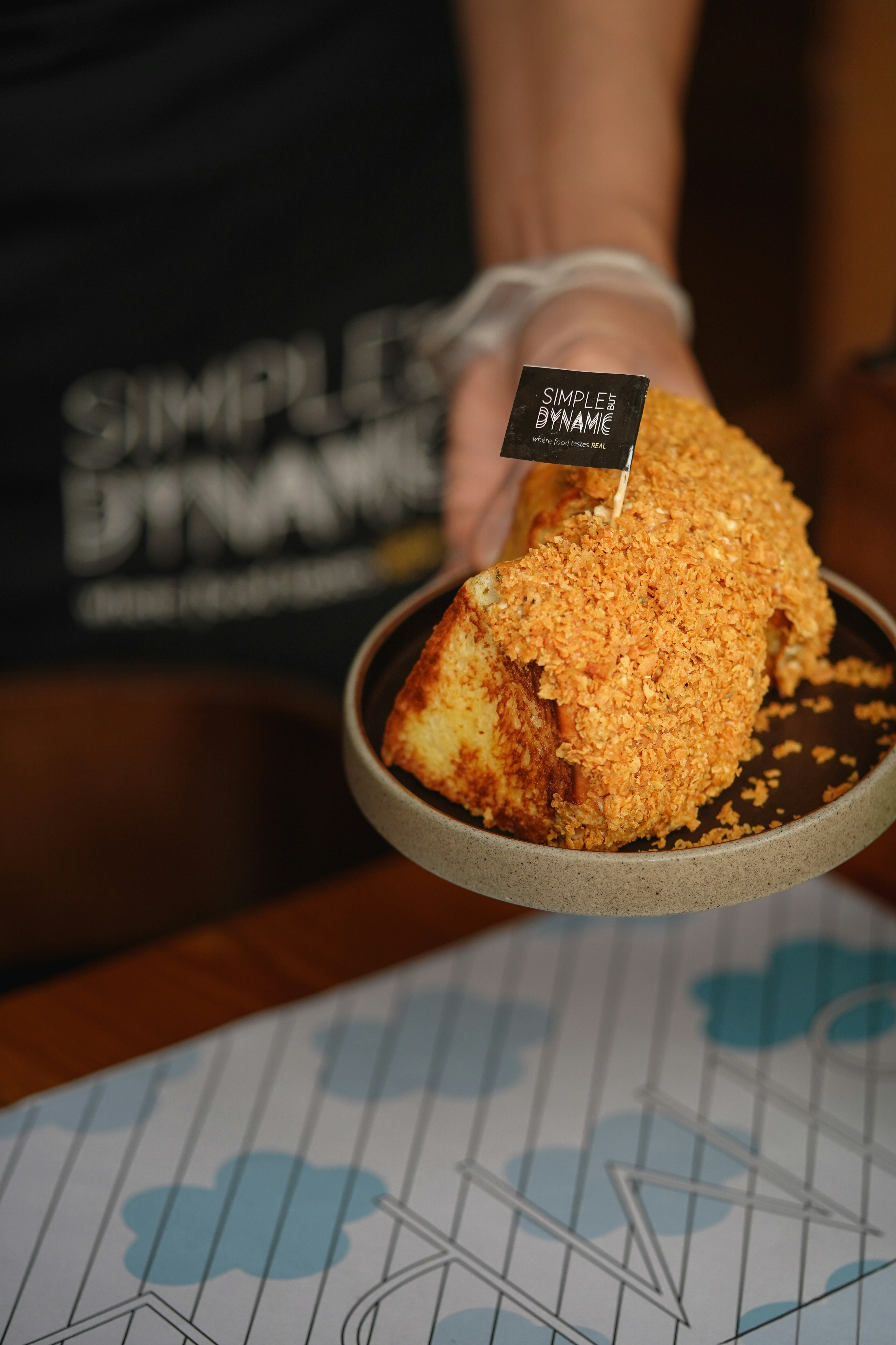 Crisp Crumb Crown: Fried Chicken Highlighted by a Tiny Sign