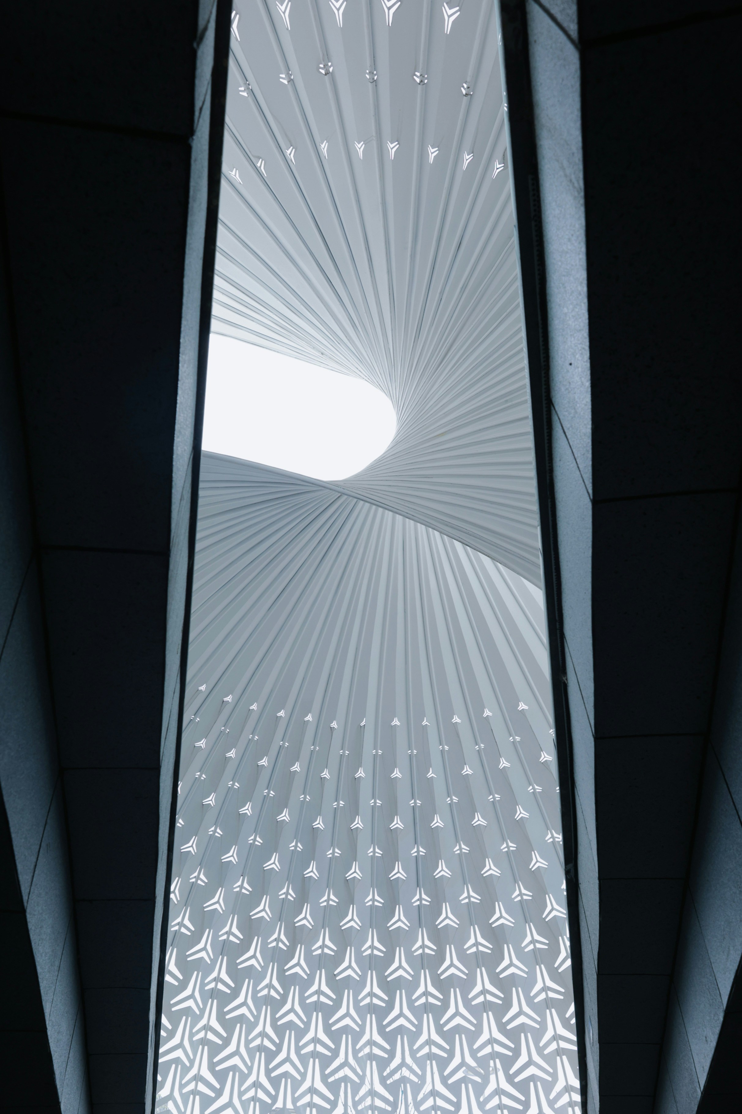 A very tall building with a very large window photo – Free Grey Image ...