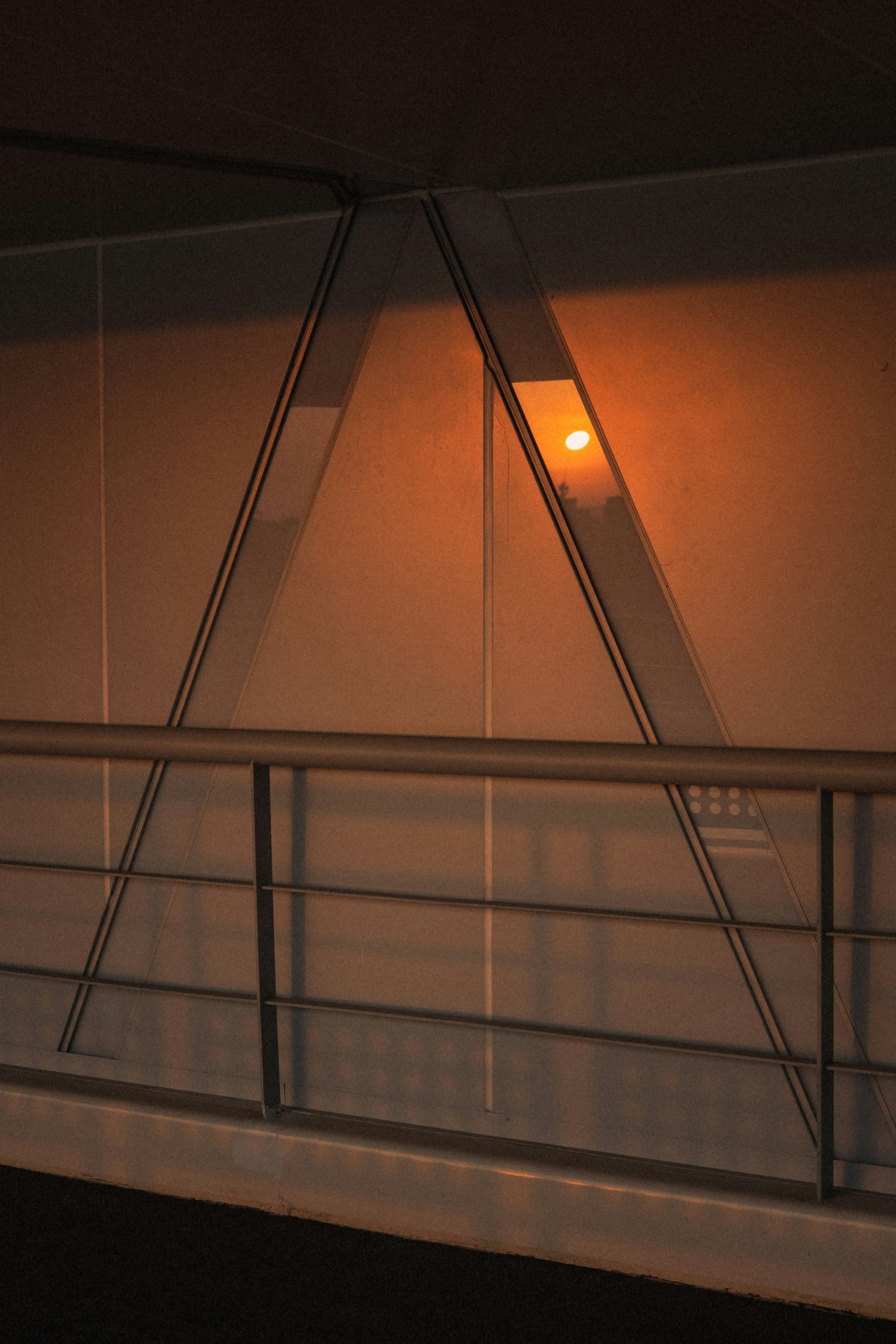 a street light is reflected in a window