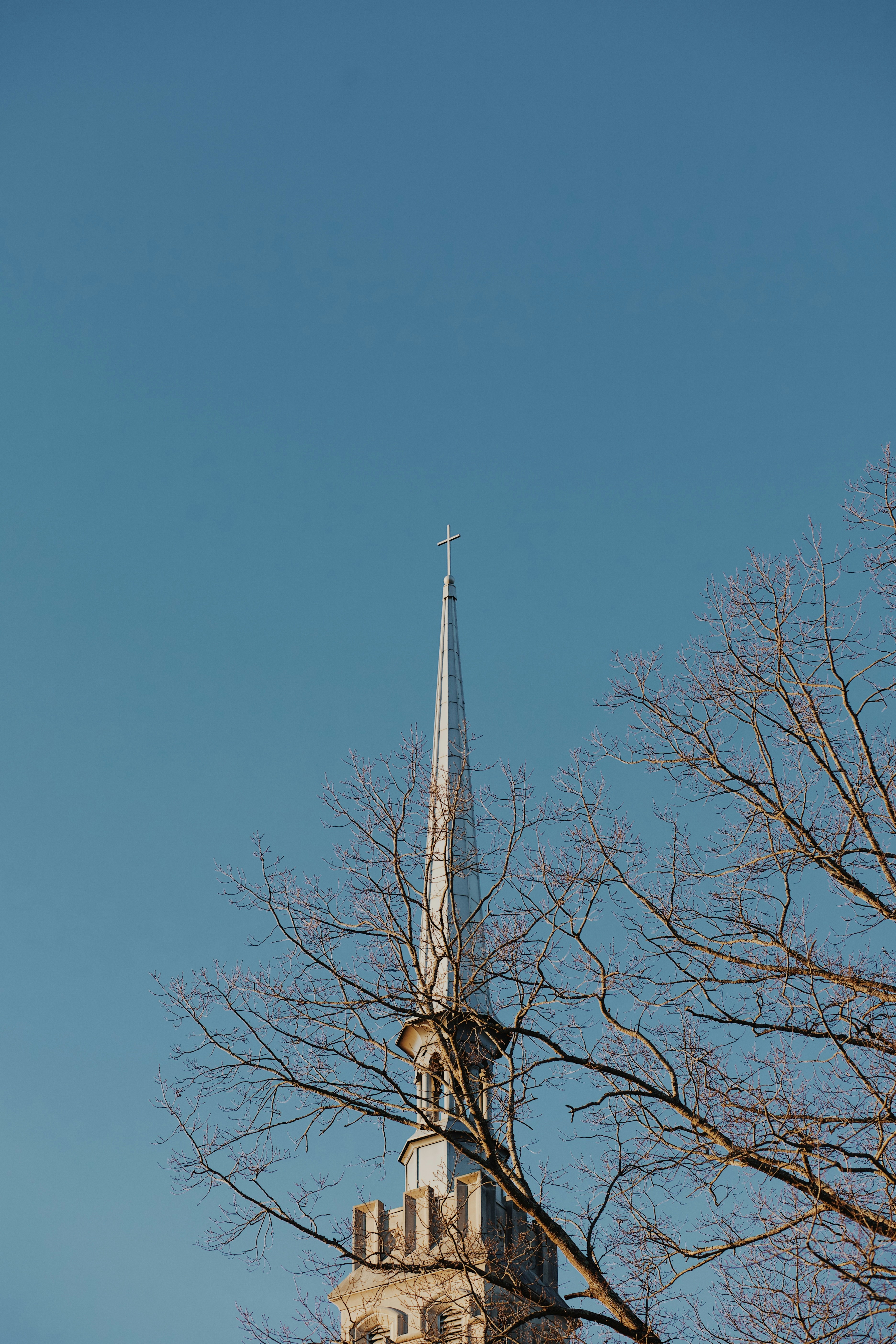 A very tall building with a steeple on top of it photo – Free Grey ...