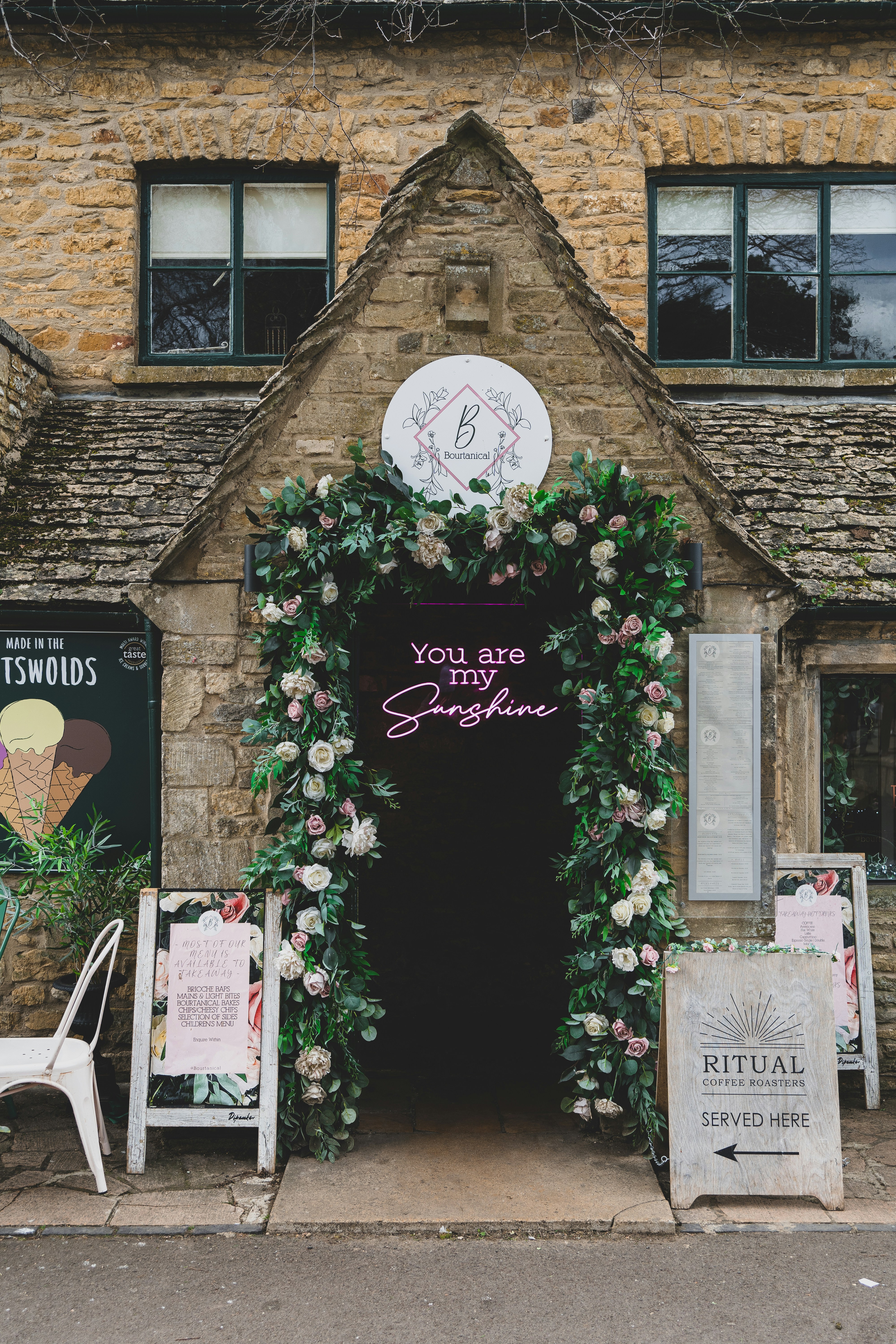 Sunshine Gate: A Floral Gateway to a Rustic Café