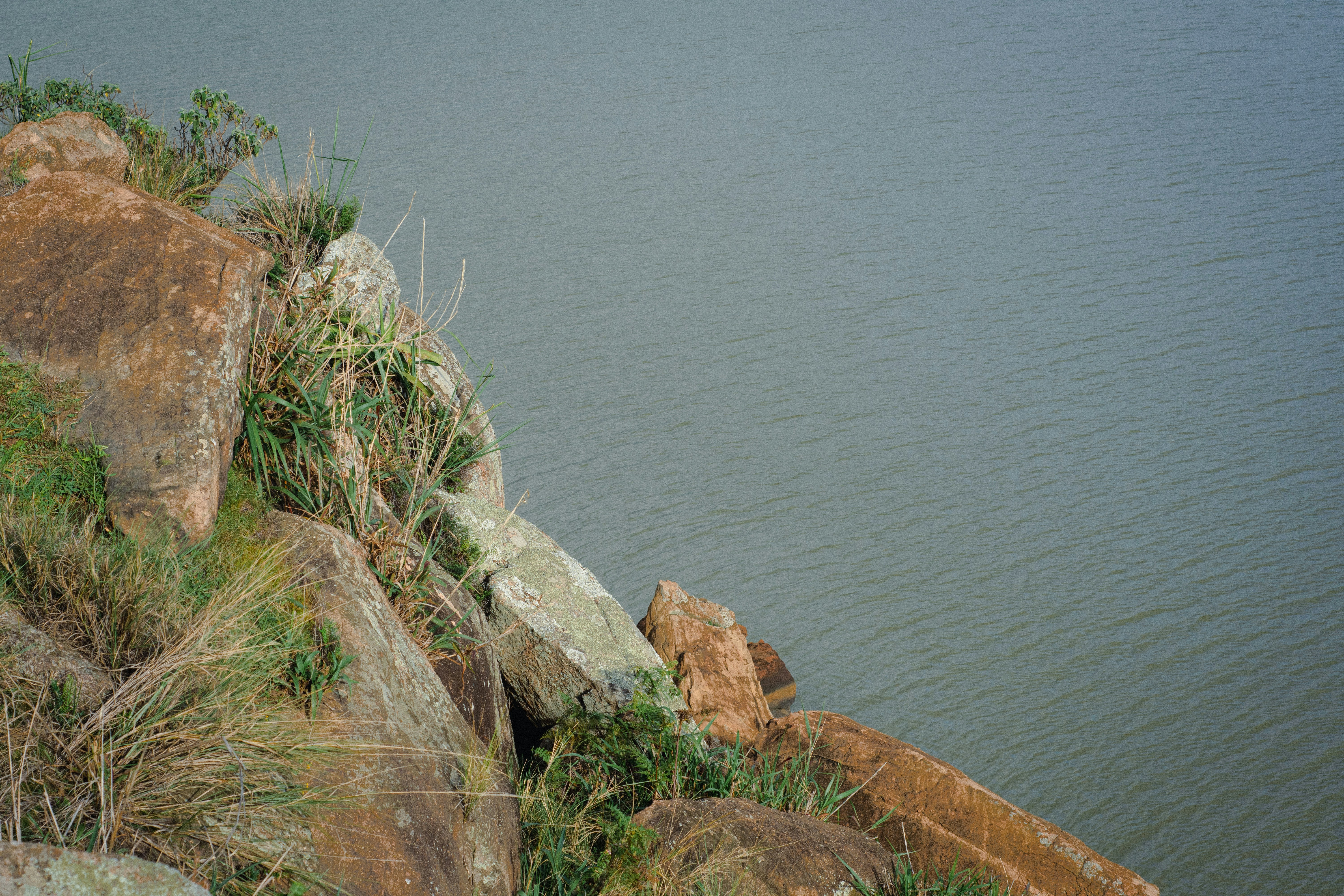 a large body of water surrounded by rocks