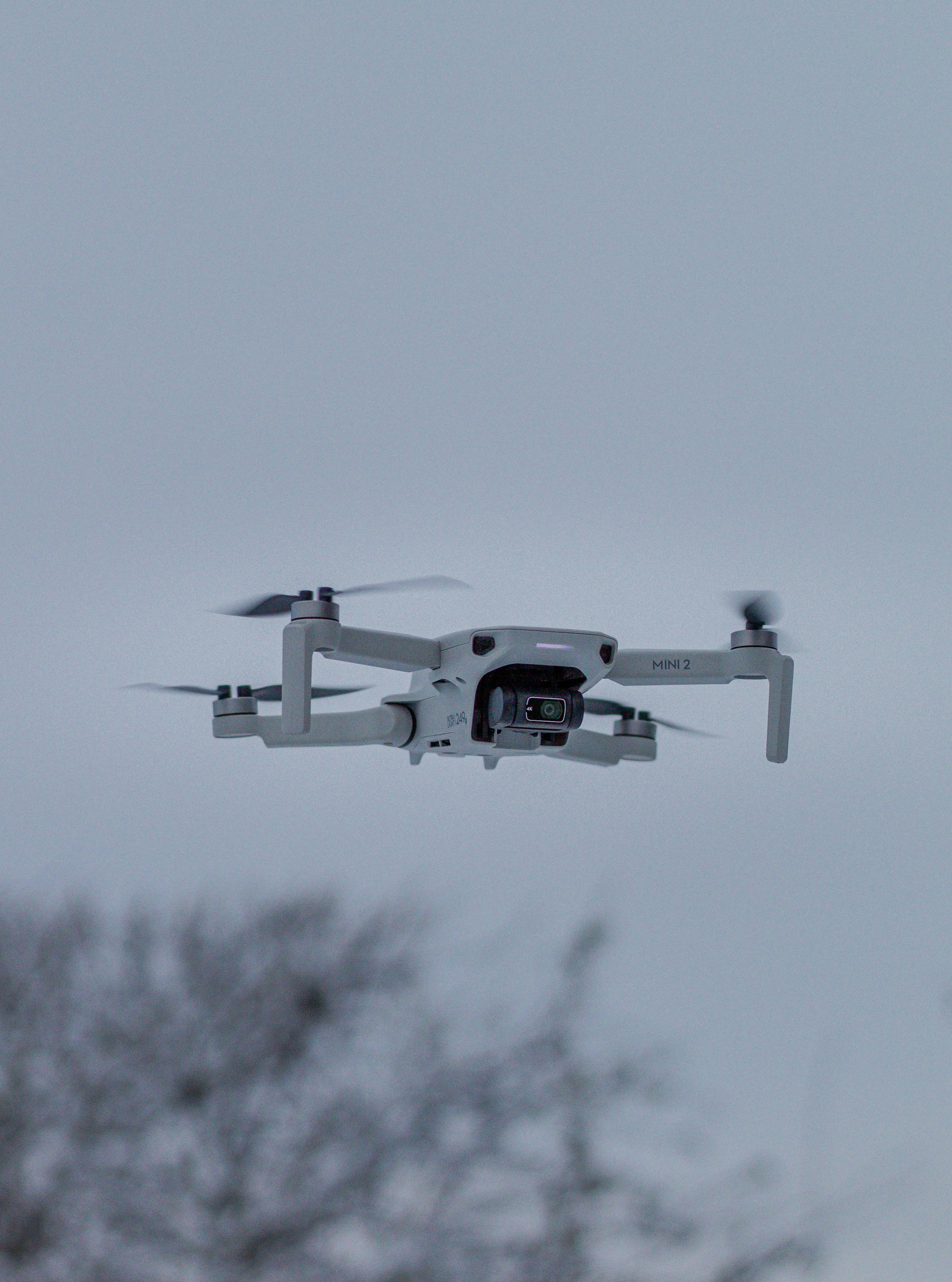 A large white and black object flying in the sky photo – Free Grey ...