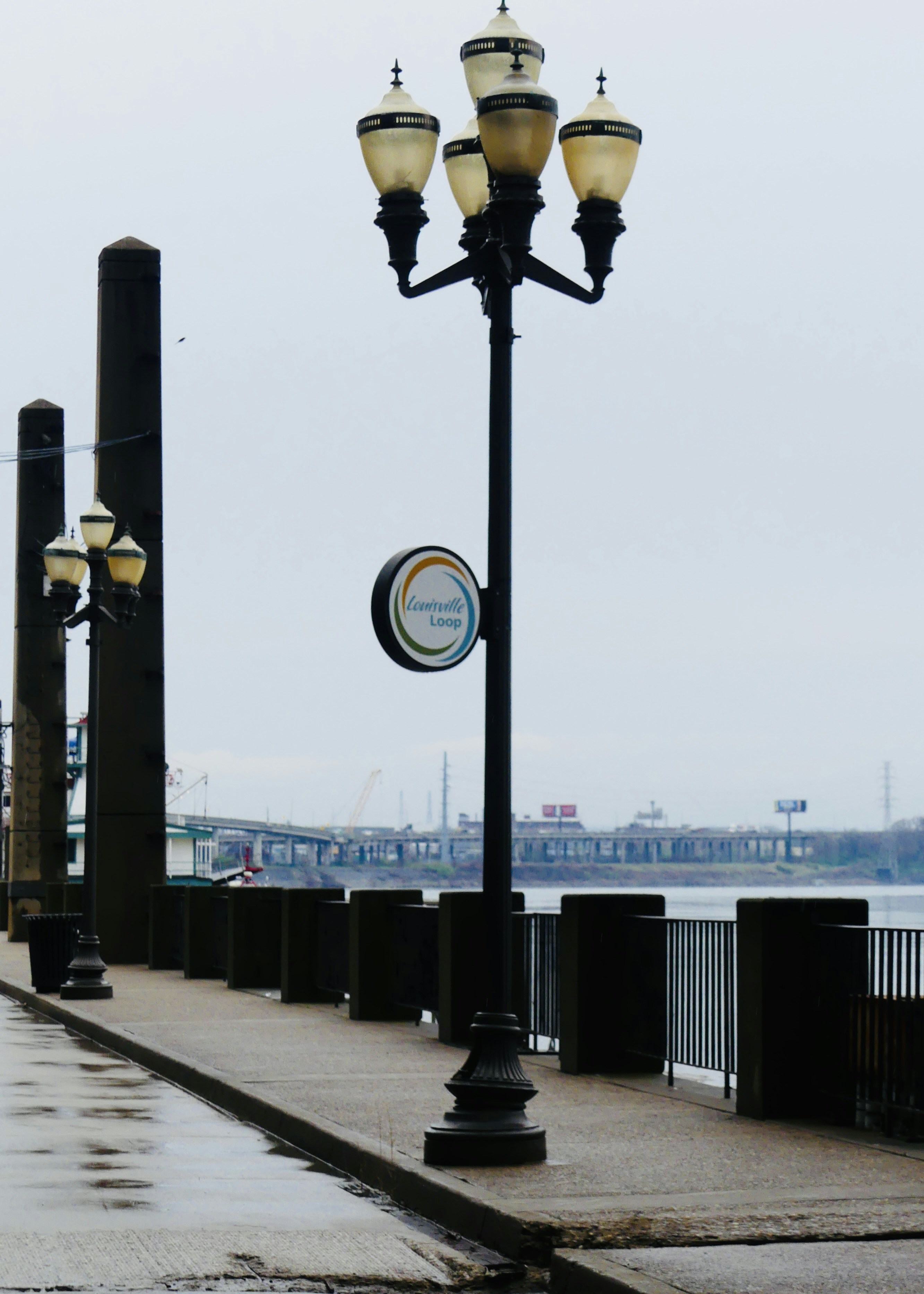 A street light sitting on the side of a road photo – Free Louisville ...