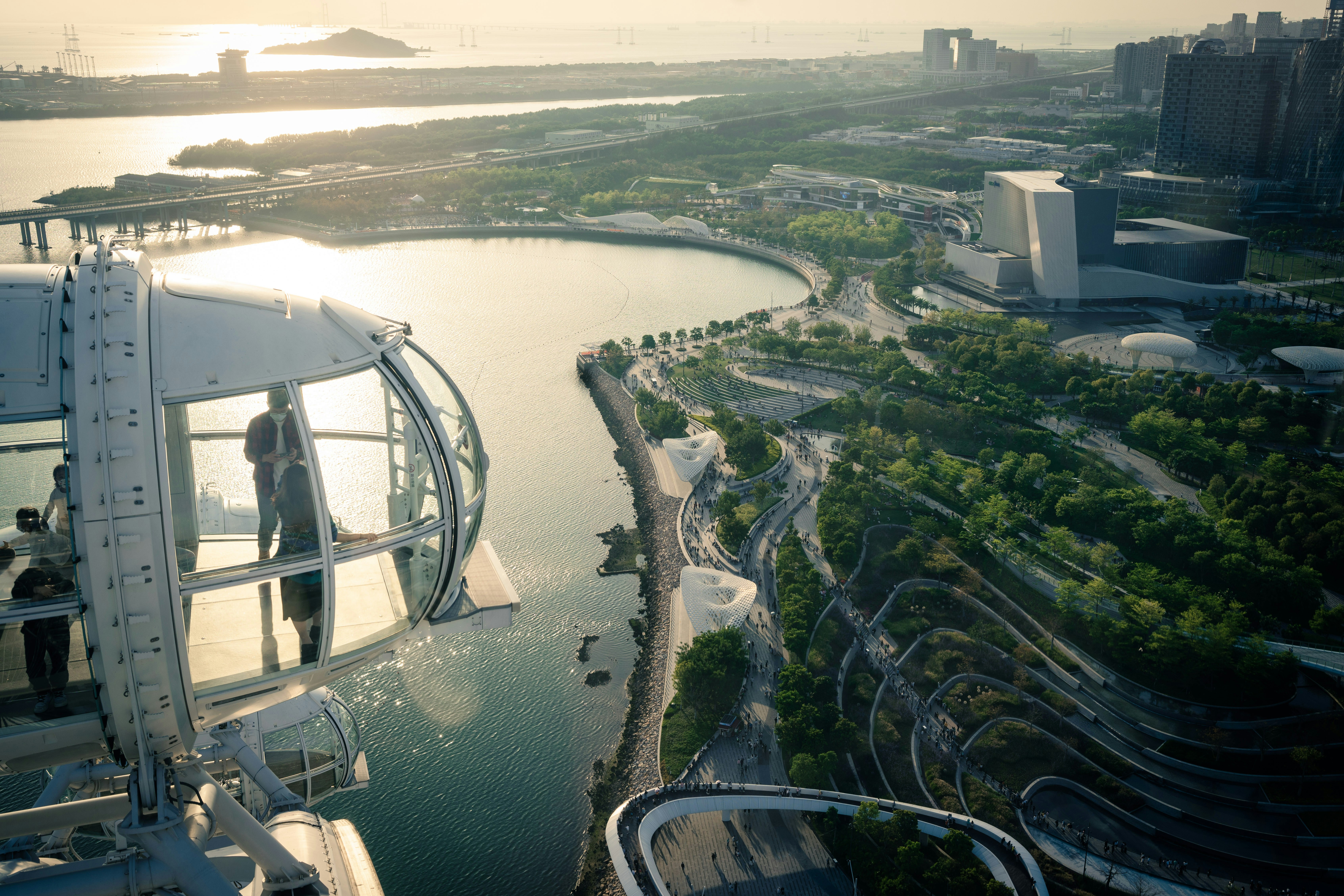 Skyward View: Glass Capsule Over a Waterfront City