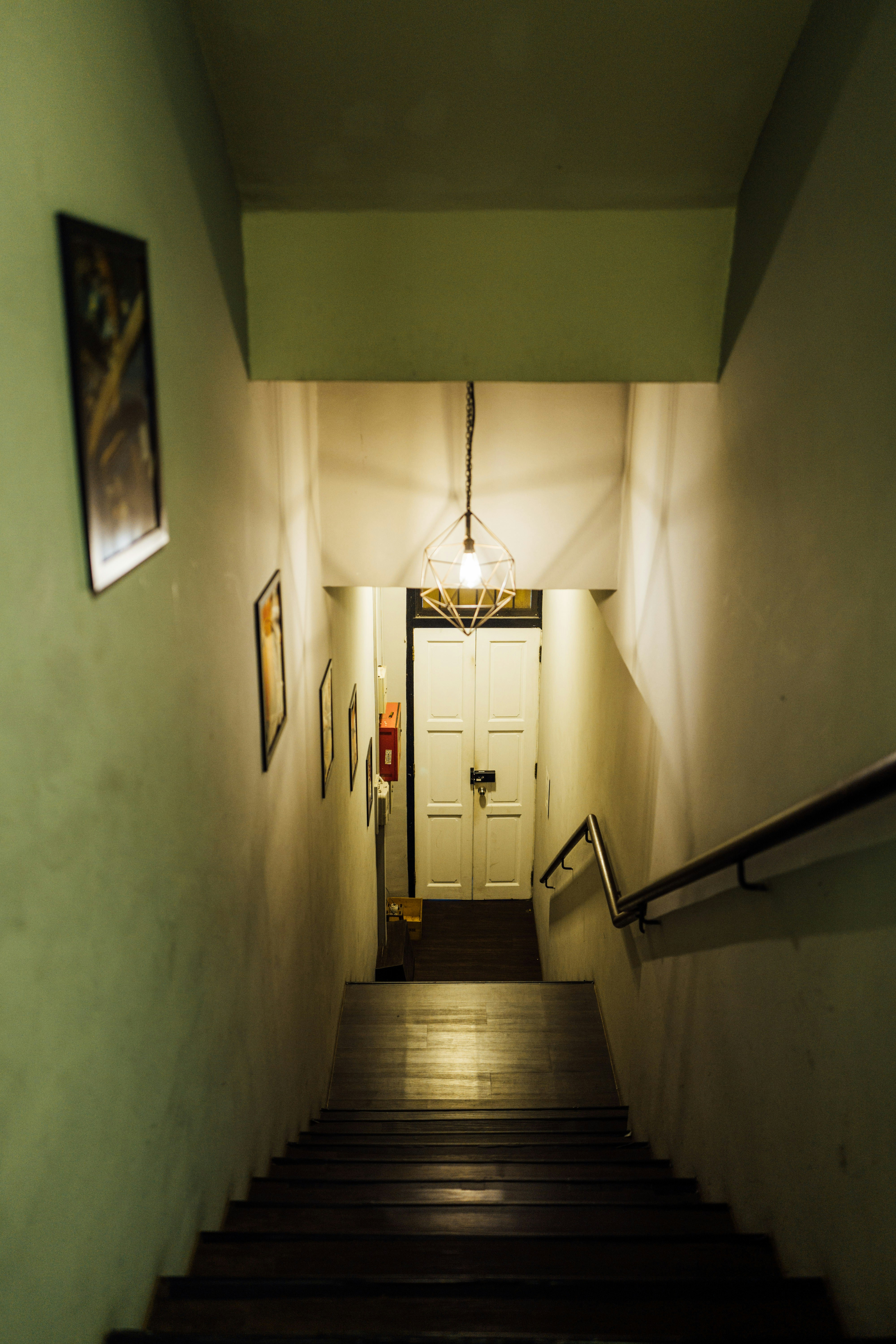 Geometry and Glow: A Stairwell Leading to a Quiet Doorway