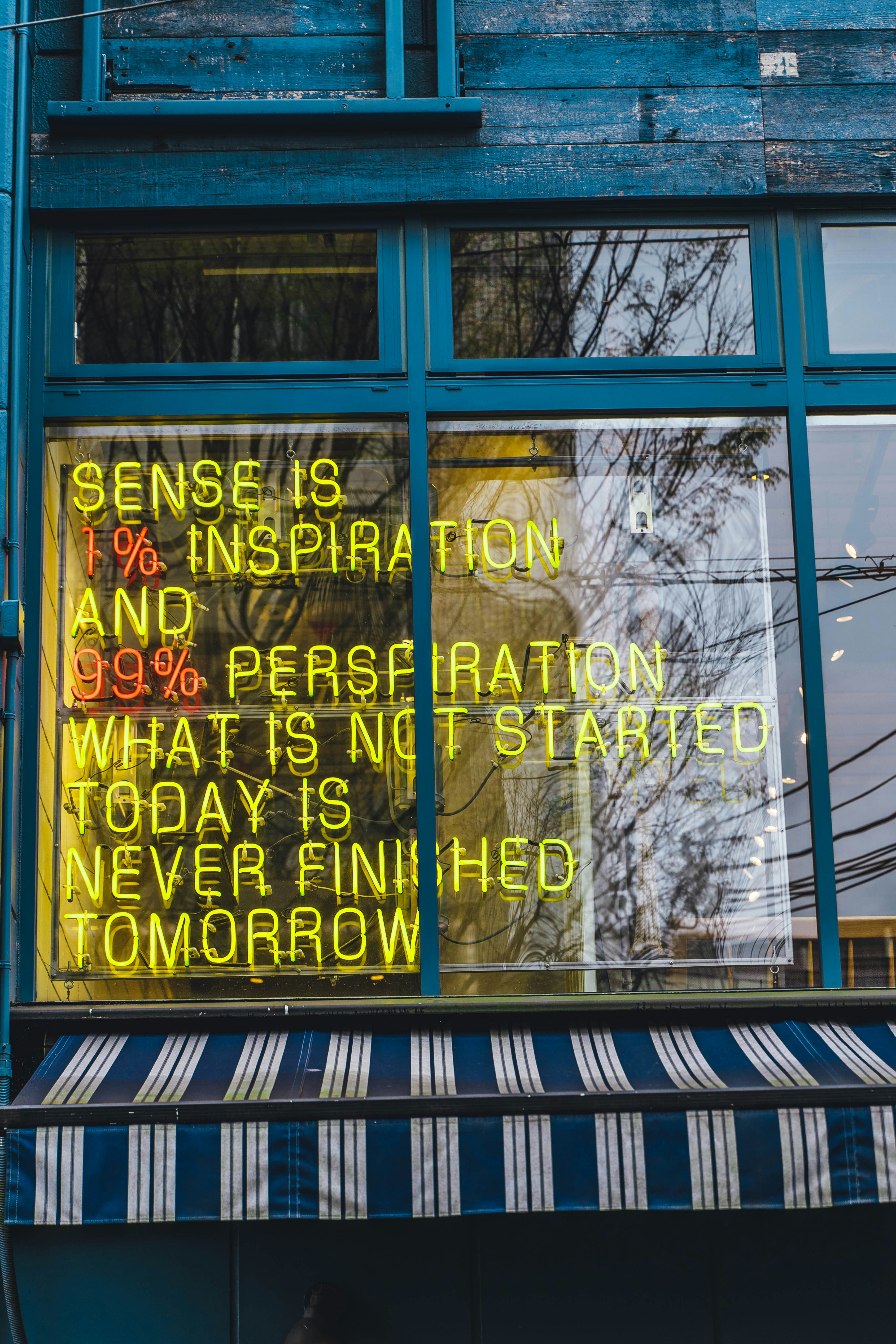 Neon Mantra in a Teal Facade: Inspiration Illuminated